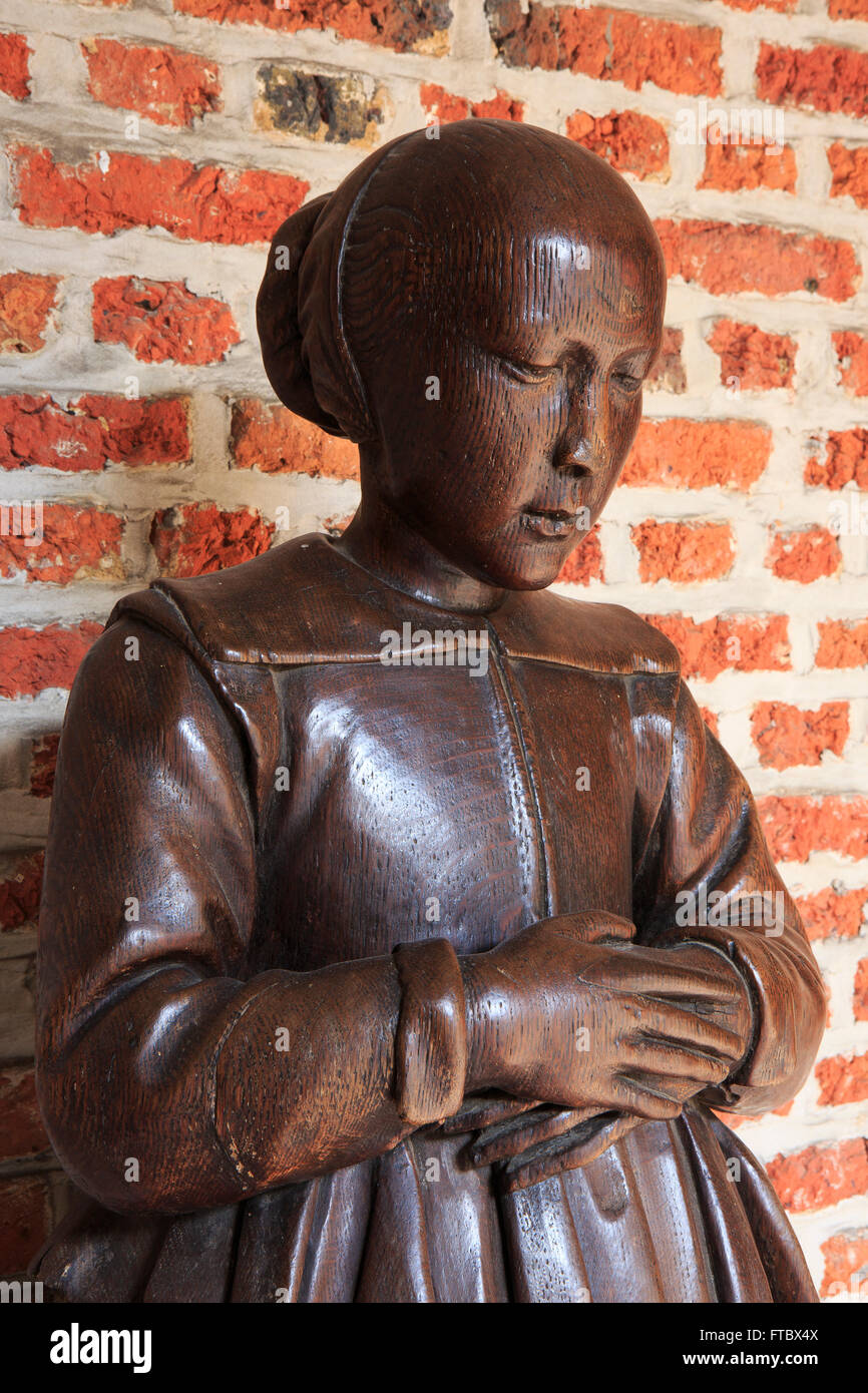 A wooden statue of an orphaned girl at the Maidens' House Museum ...