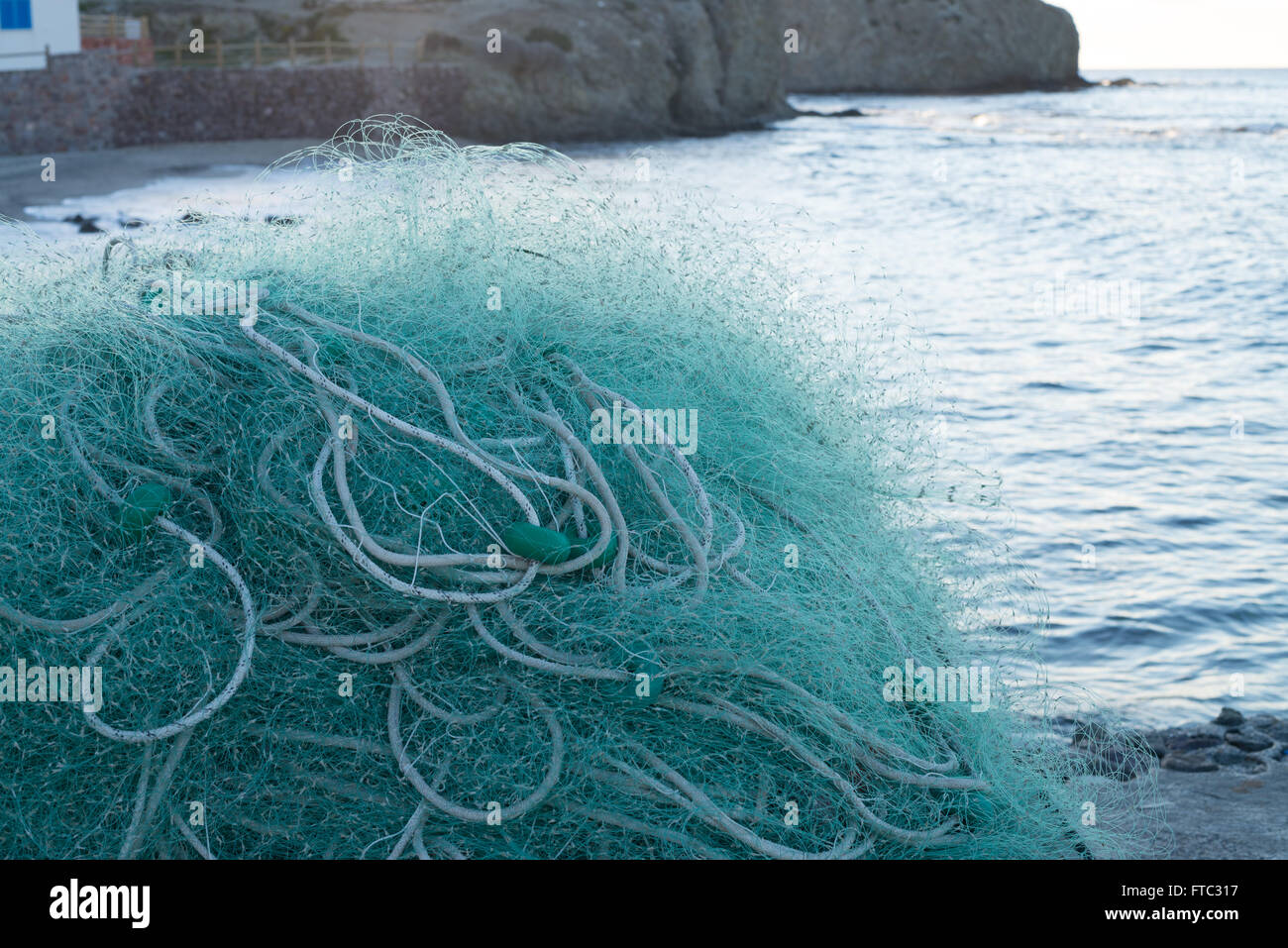 Traditional fishing nets in a small harbor Stock Photo - Alamy