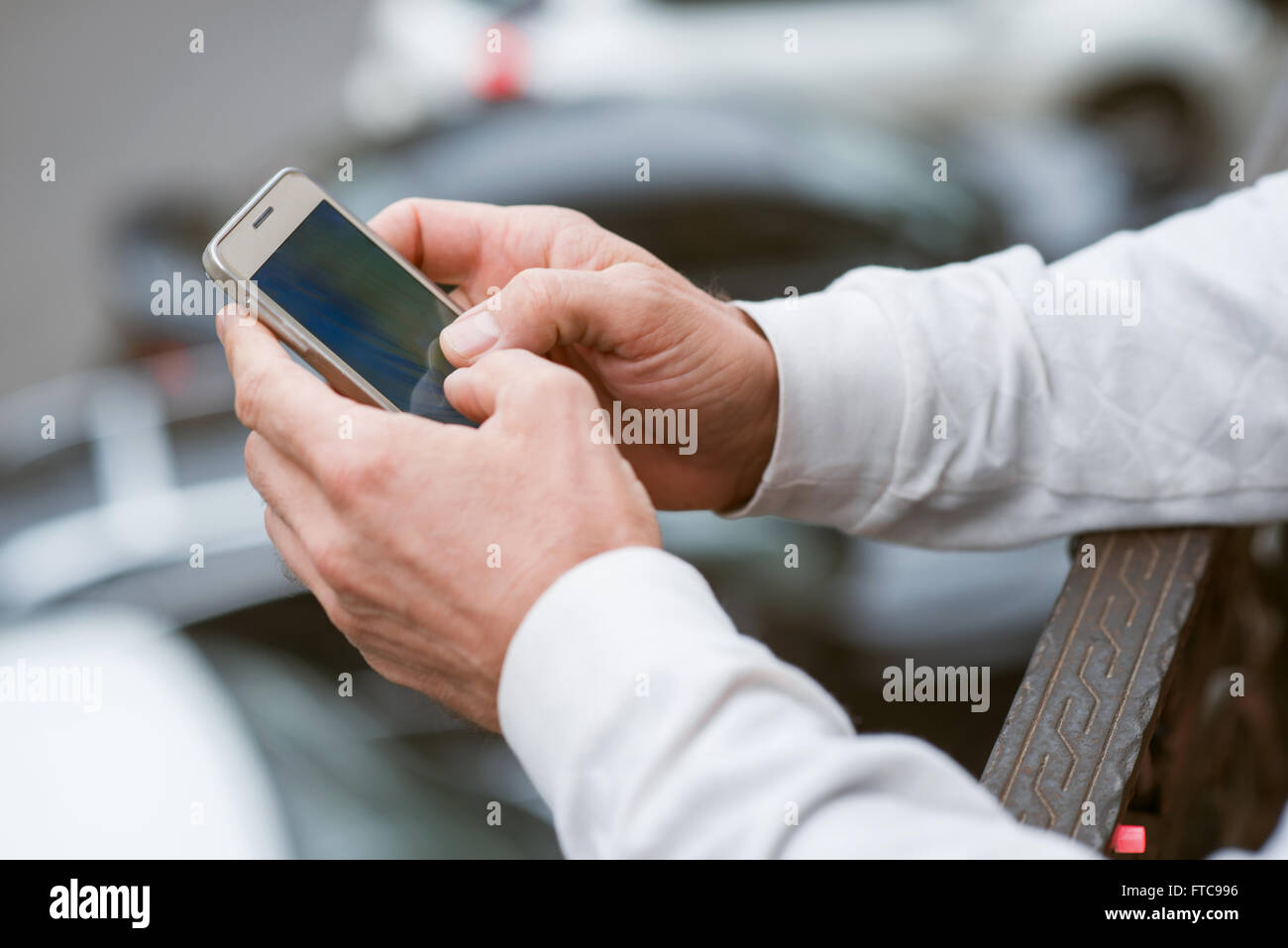 Modern man holding cell phone Stock Photo - Alamy