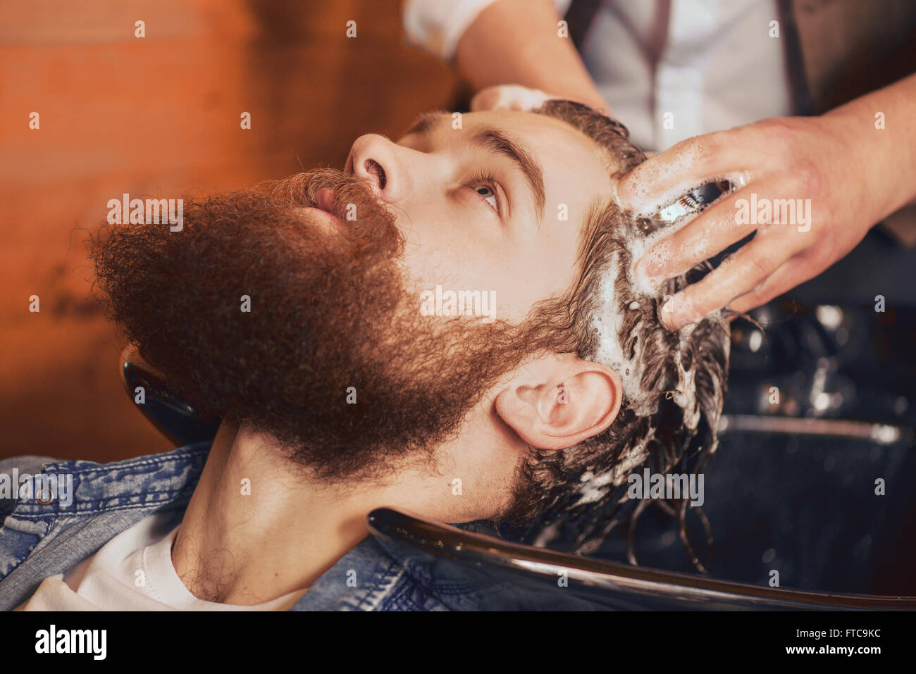 professional barber washing head of his client Stock Photo - Alamy