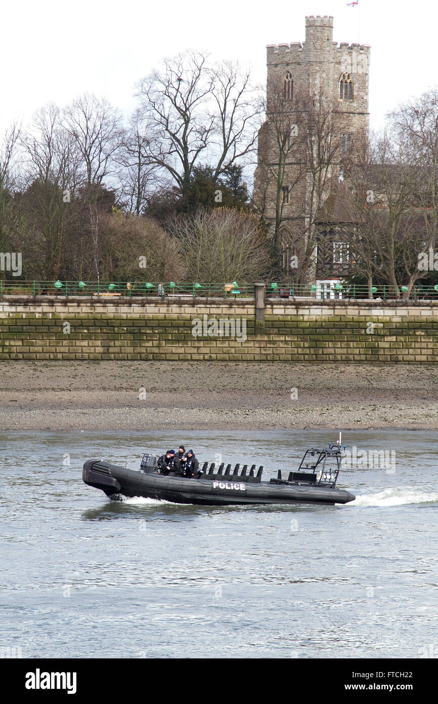 Putney London, UK. 27th March 2016. A police dinghy speed boat patrols ...