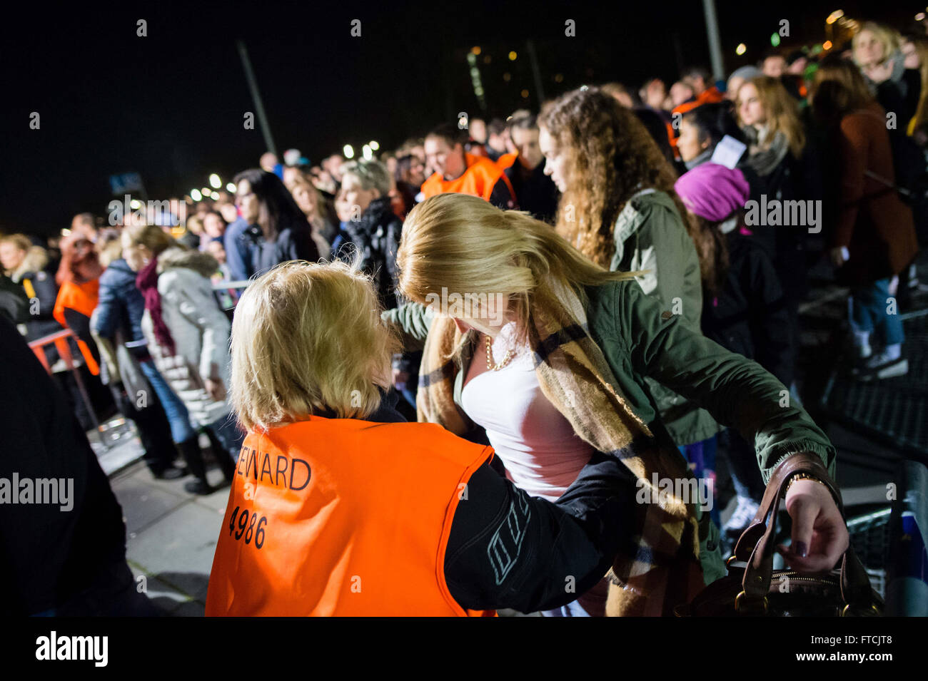 Berlin, Germany. 26th Mar, 2016. Viewers and fans are checked and ...