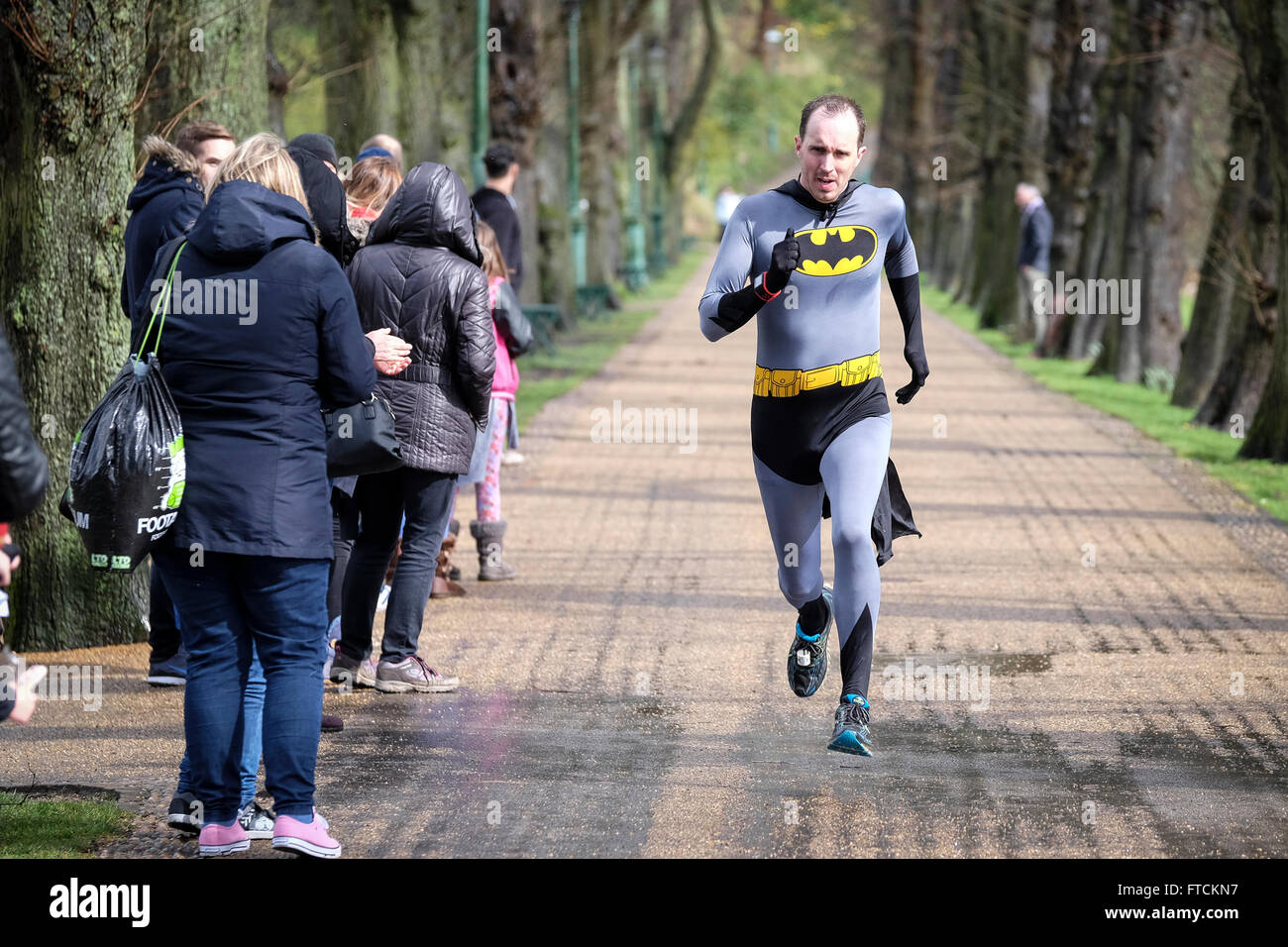 Runner dressed as Batman taking part in charity race event Stock Photo ...