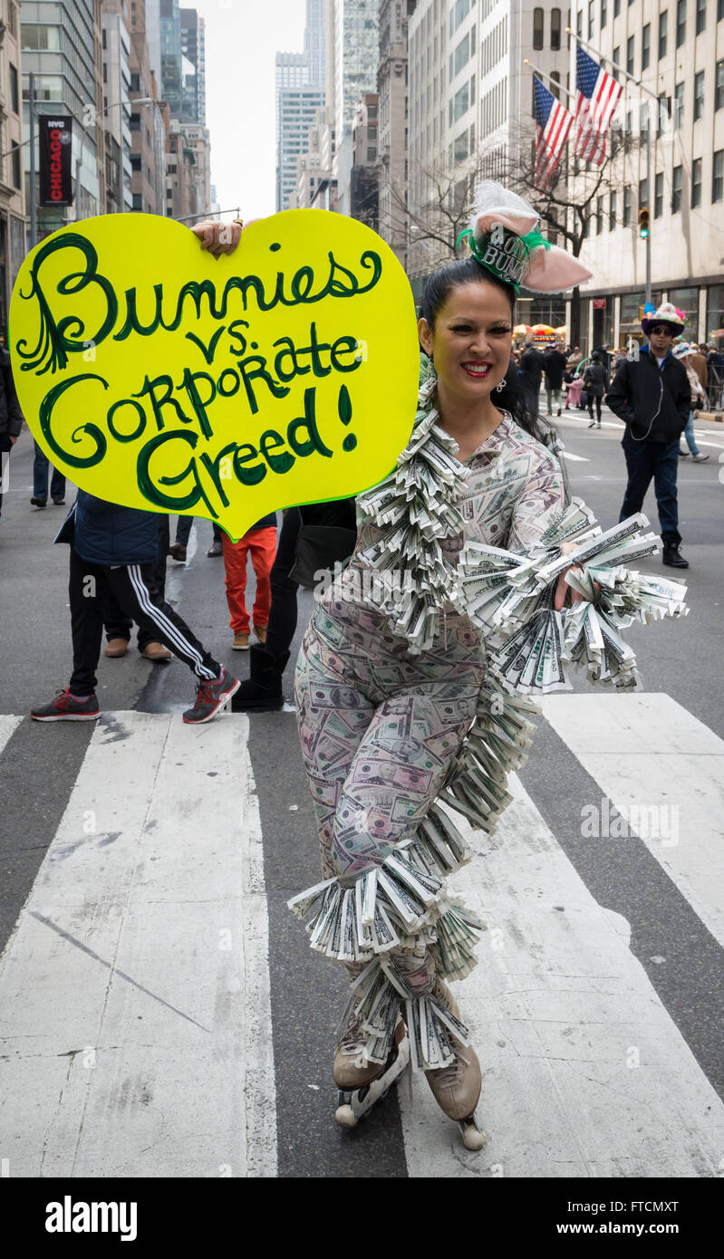 A woman protesting against capitalism in a costume covered in dollar ...