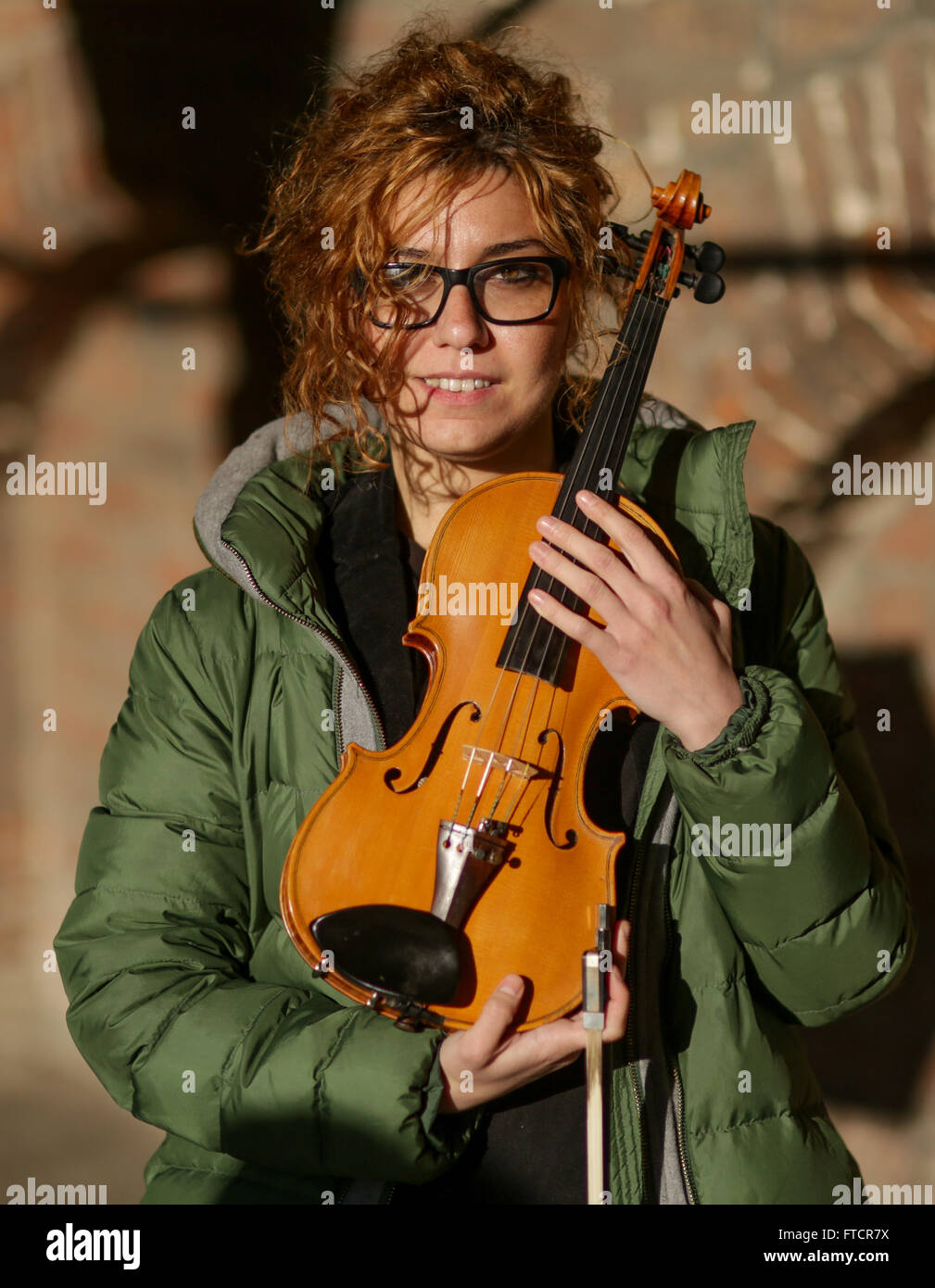 Luebeck, Germany. 16th Mar, 2016. Violinist Sousan Eskandar holds up ...
