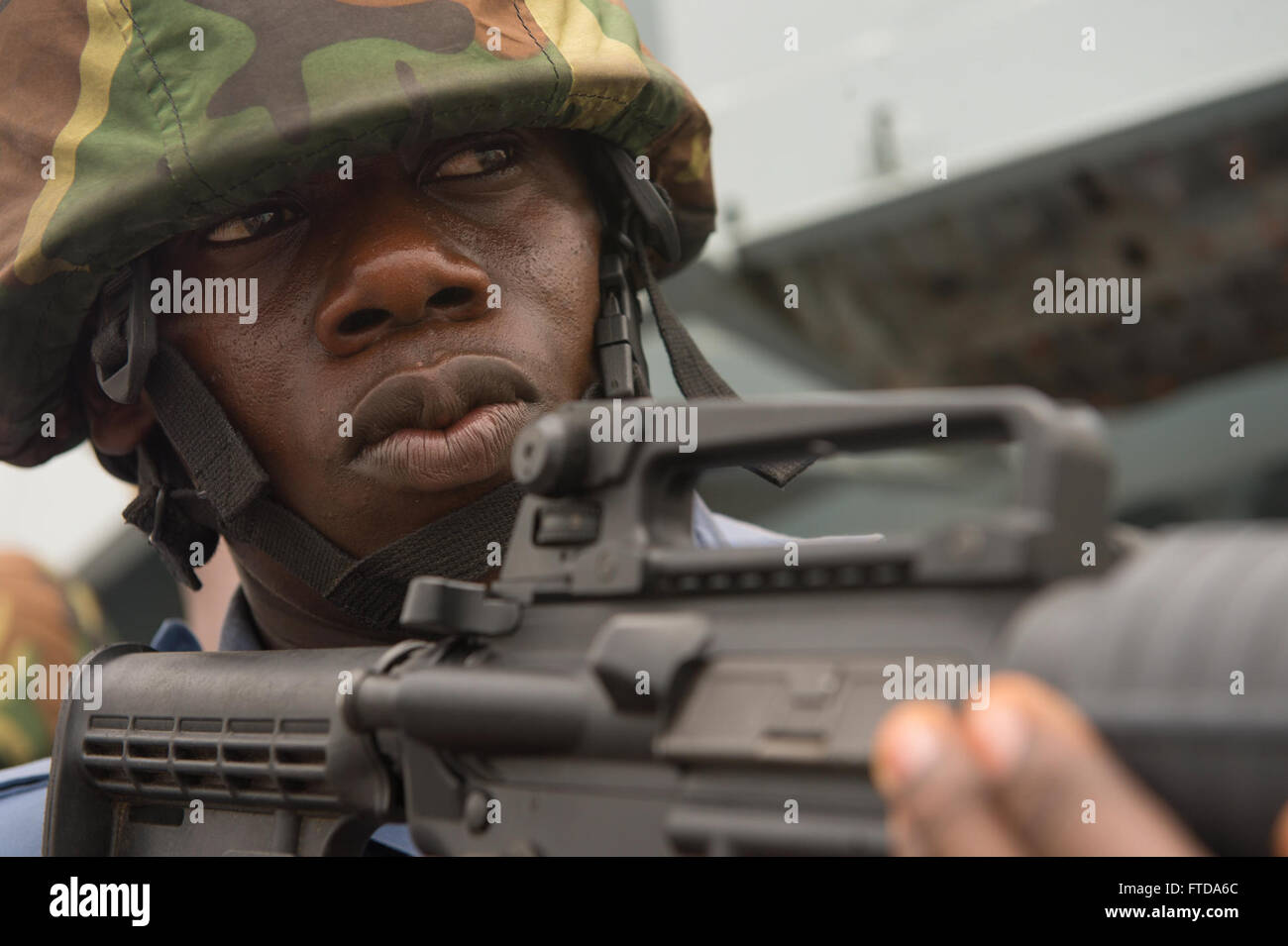 Security force member conducts search hi-res stock photography and ...