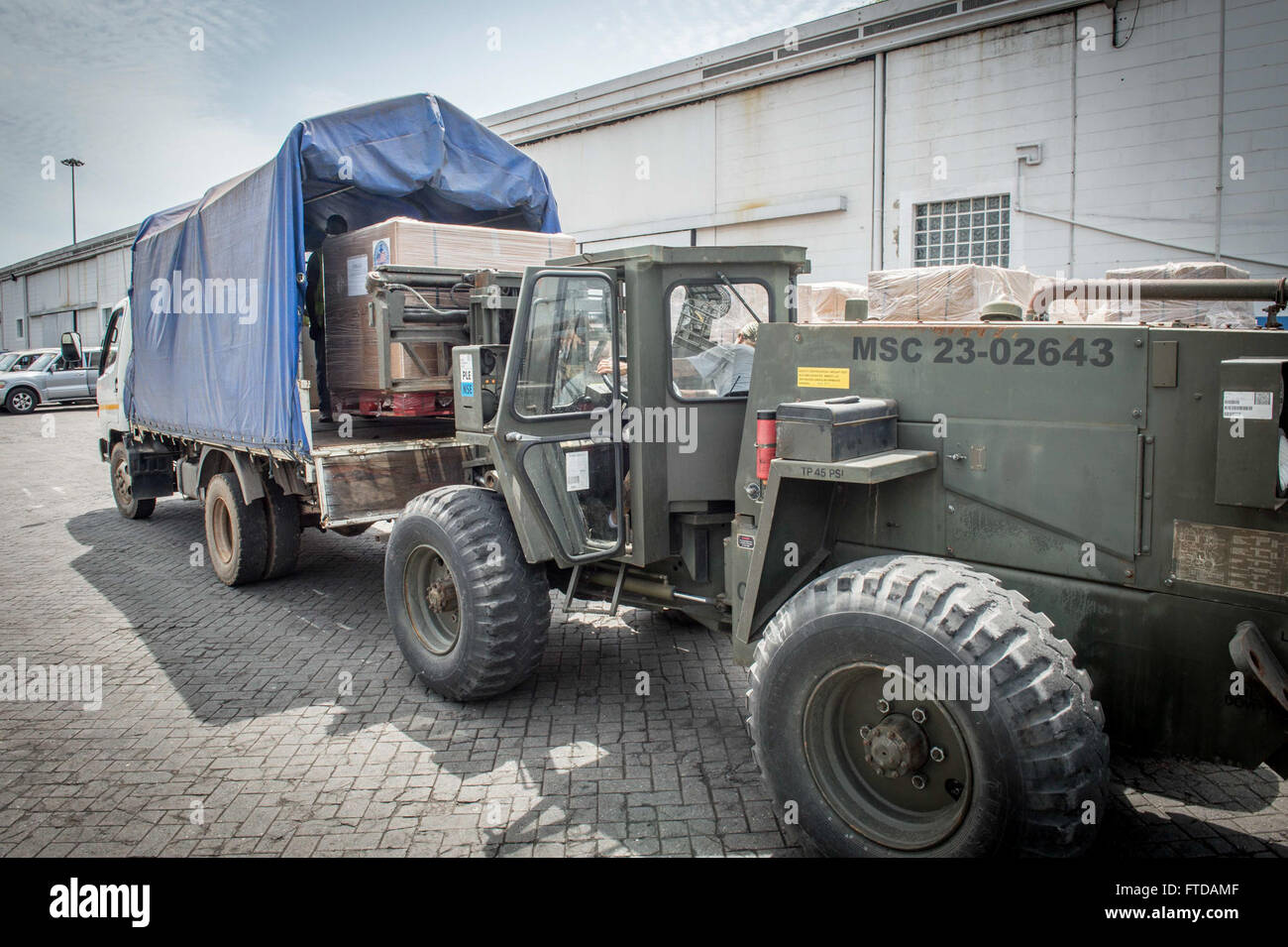 150326-N-JP249-053 TEMA, Ghana (March 26, 2015) Civil service mariners deliver supplies for ...