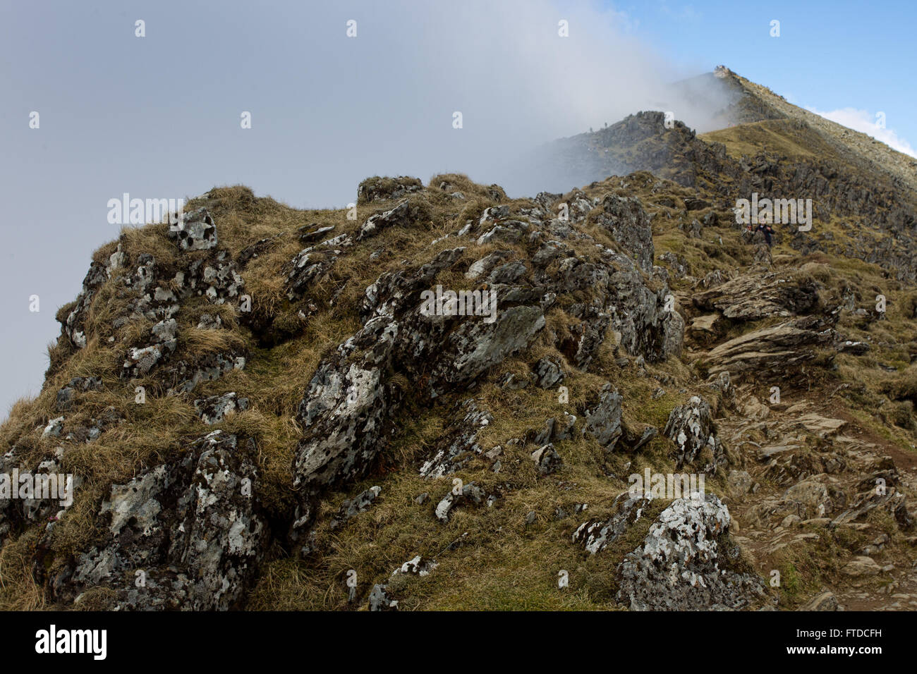 Clouds flow over the Crib Goch Ridge while ascending Snowdon along the ...