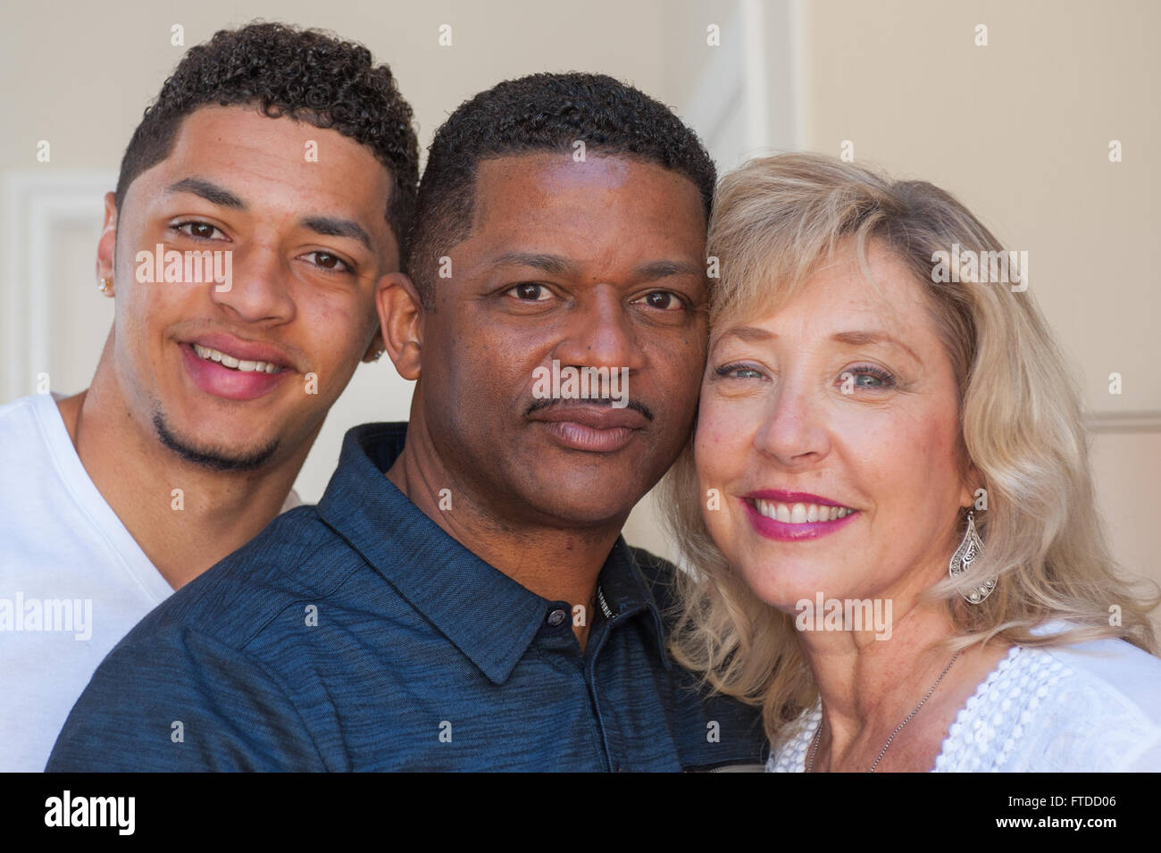 Happy mixed ethnic family posed with faces Stock Photo - Alamy