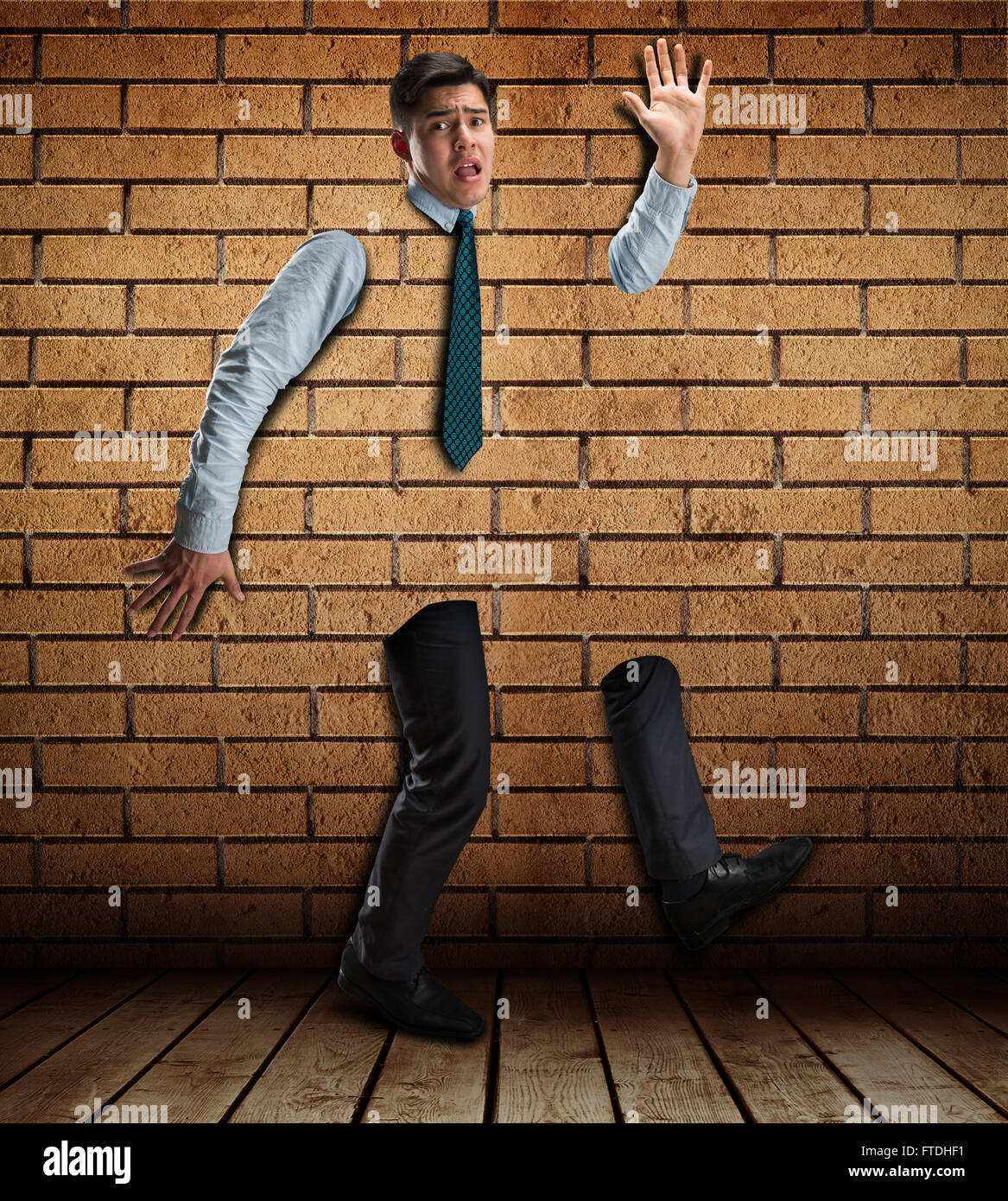 Businessman in the brick wall Stock Photo - Alamy