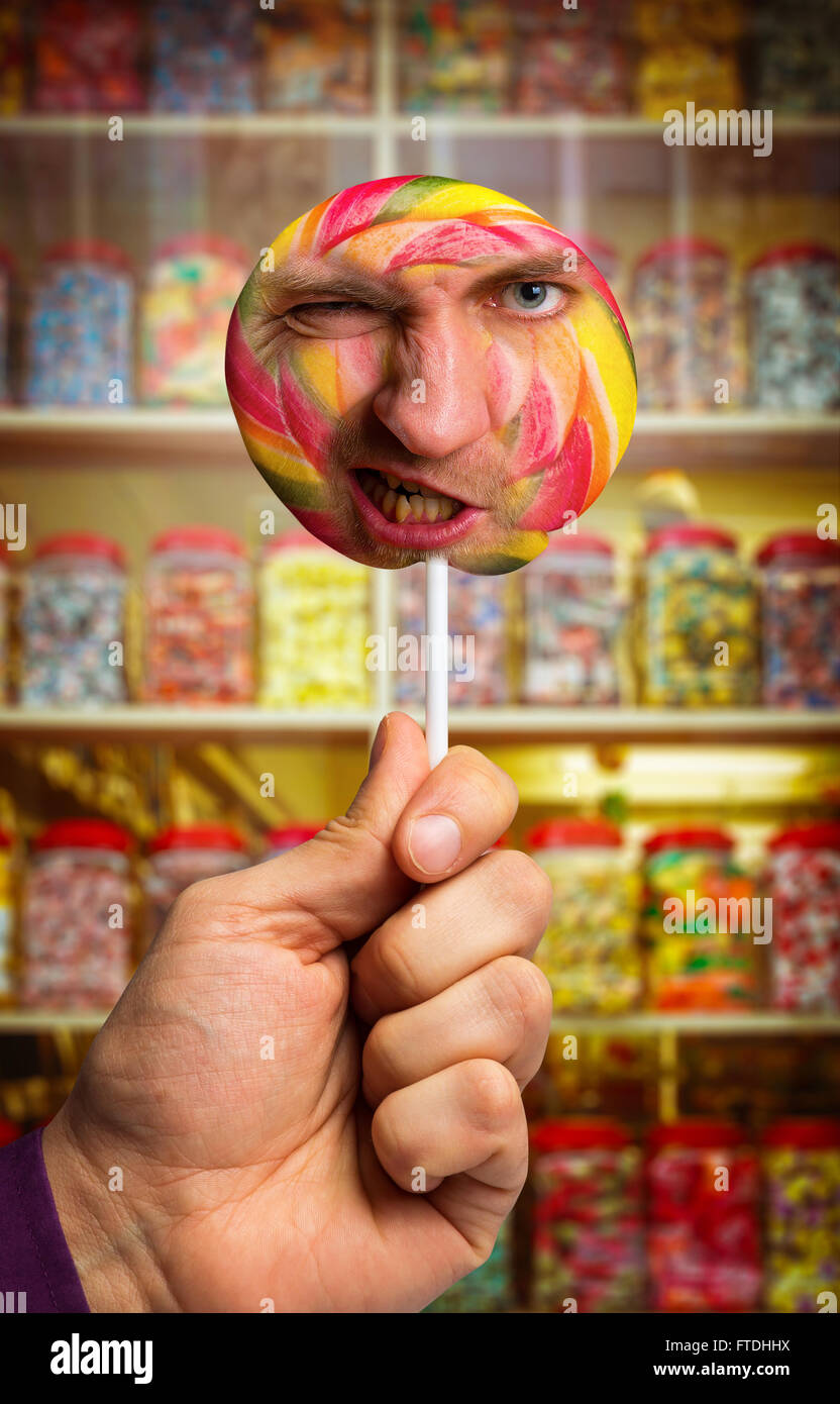 Man's face in lollipop Stock Photo - Alamy