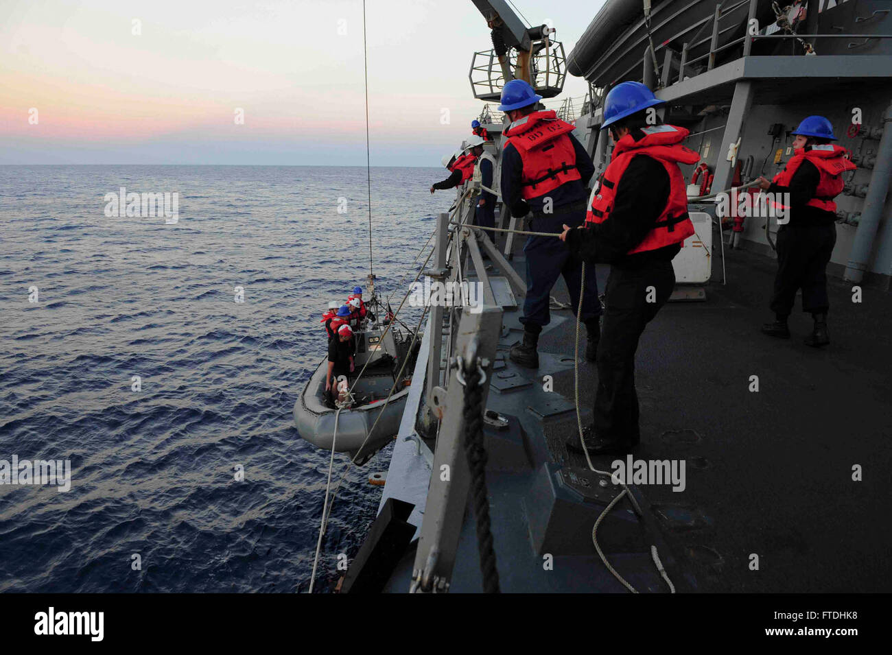 151017-N-FI568-032 MEDITERRANEAN SEA (October 17, 2015) – Sailors lower ...