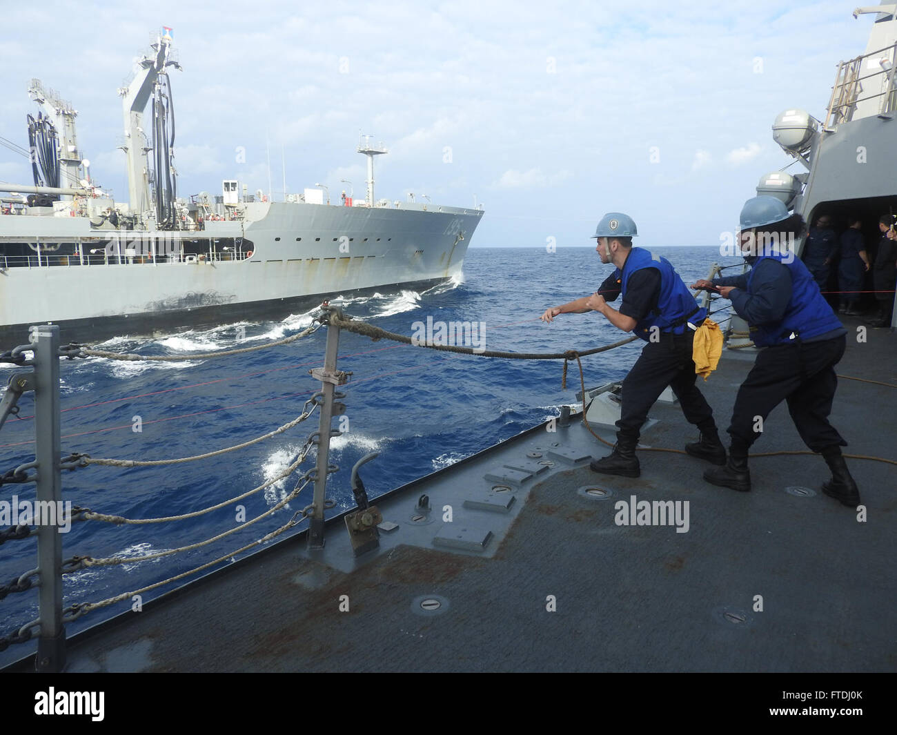 The photo shows Boatswain's Mate 3rd Class Brandon Smith and Seaman ...