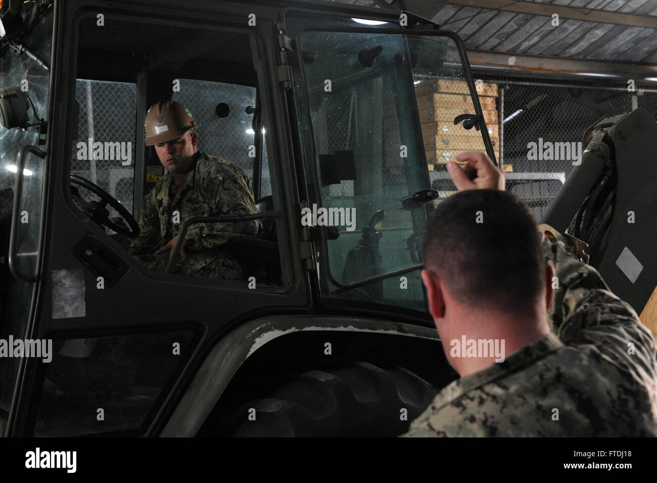 U.S. Navy sailors from Naval Mobile Construction Battalion (NMCB) 1 ...