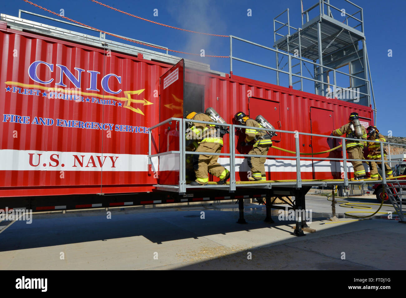 U.S. Navy firefighters at NSA Souda Bay in Greece conduct a live fire ...