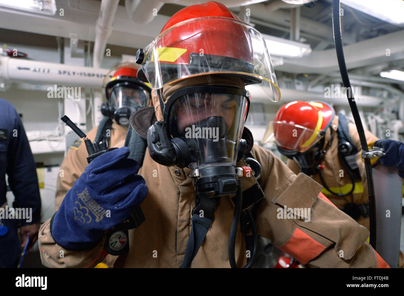 A photograph showing U.S. Navy Damage Controlman Fireman Phillip ...