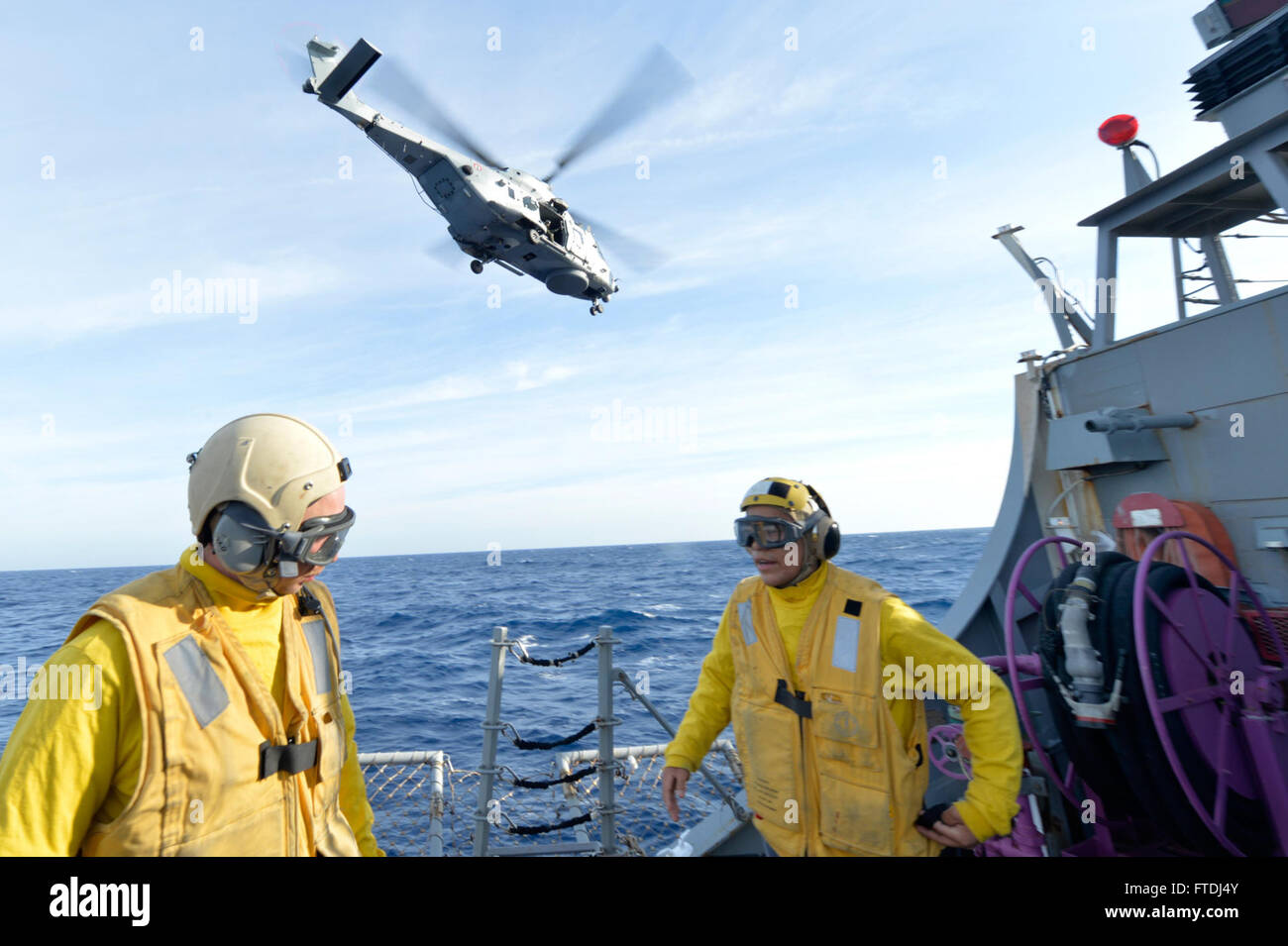 Sailors aboard the USS Ross (DDG 71), an Arleigh Burke-class guided ...