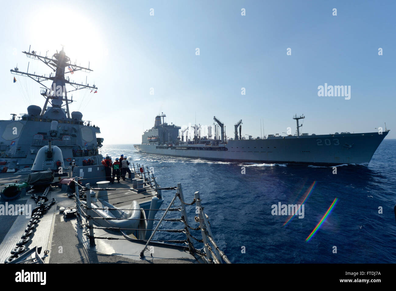 Sailors aboard the USS Ross (DDG 71), an Arleigh Burke-class guided ...