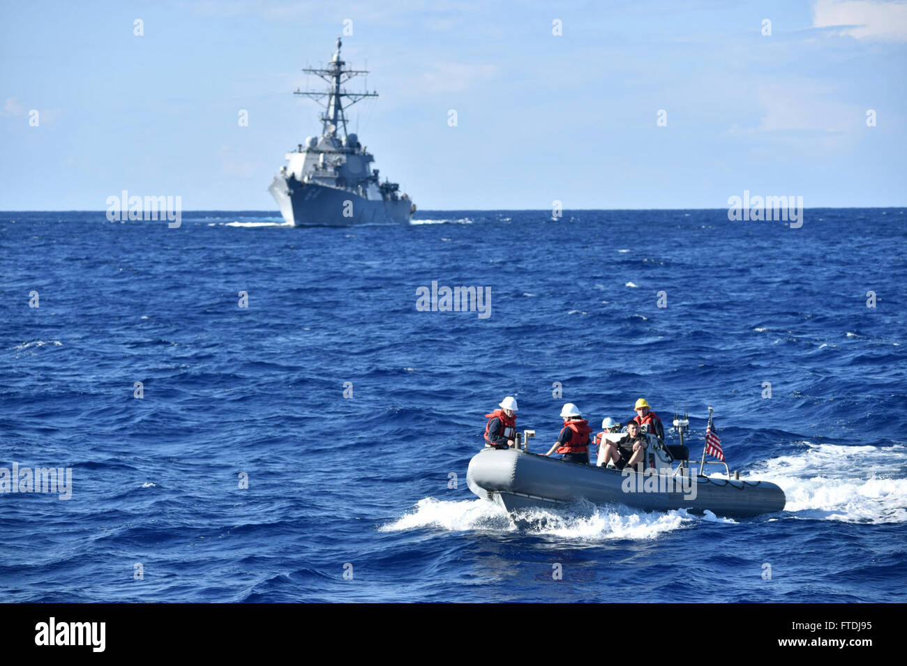 This image shows sailors conducting small boat operations aboard the ...