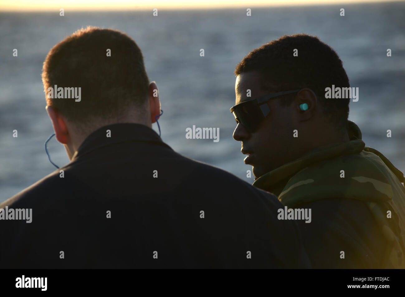 Sailors aboard the USS Ross (DDG 71), an Arleigh Burke-class guided ...