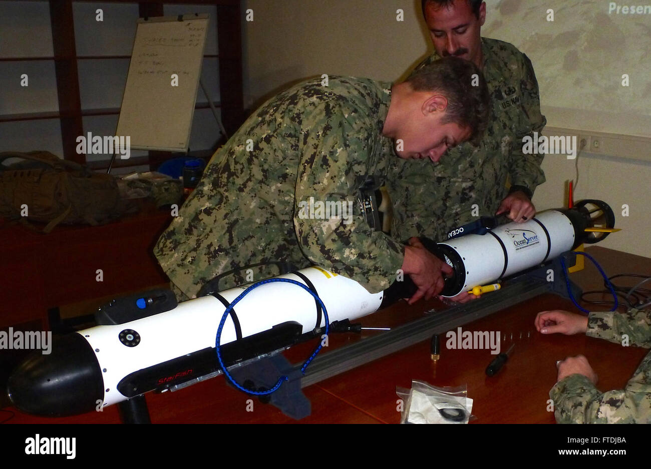 U.S. Navy Explosive Ordnance Disposal Technicians conduct operational ...