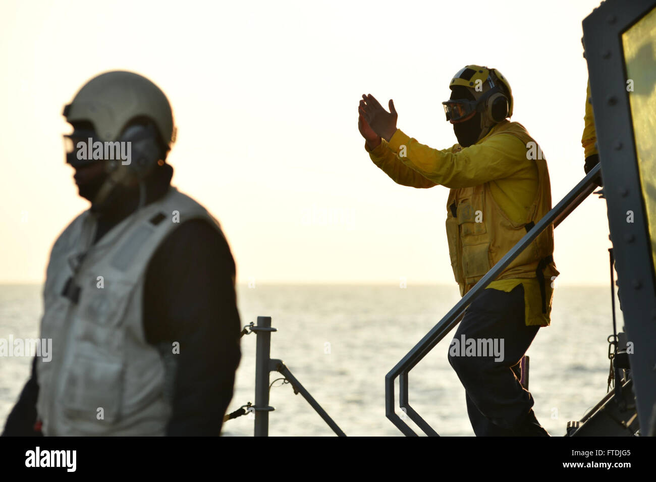 Sailors aboard the USS Ross (DDG 71) conduct deck-landing ...