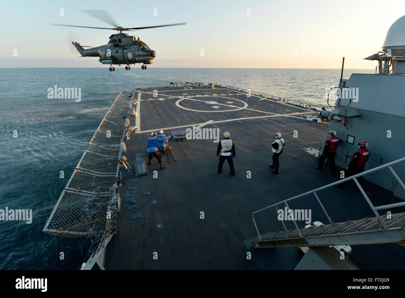 On December 5, 2015, sailors aboard the USS Ross (DDG 71), an Arleigh ...
