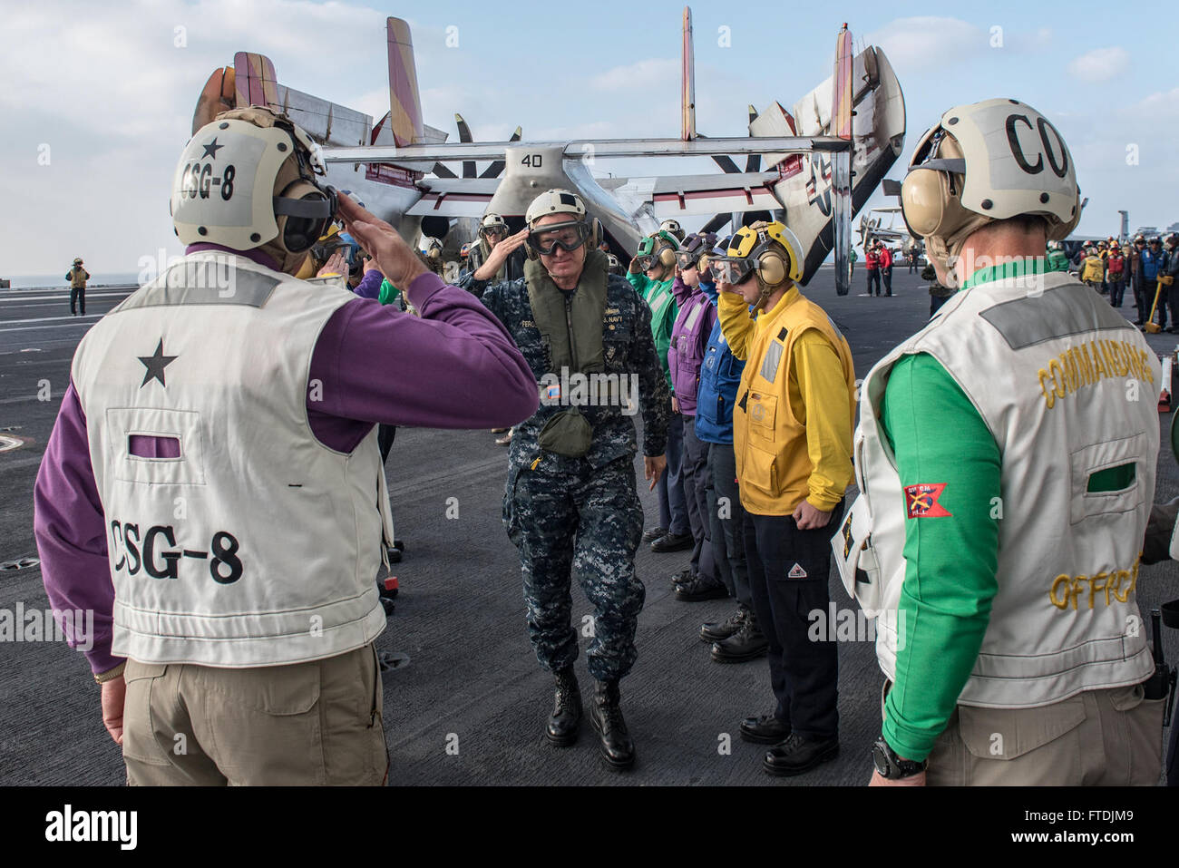 This photograph shows Adm. Mark Ferguson being welcomed aboard the USS ...
