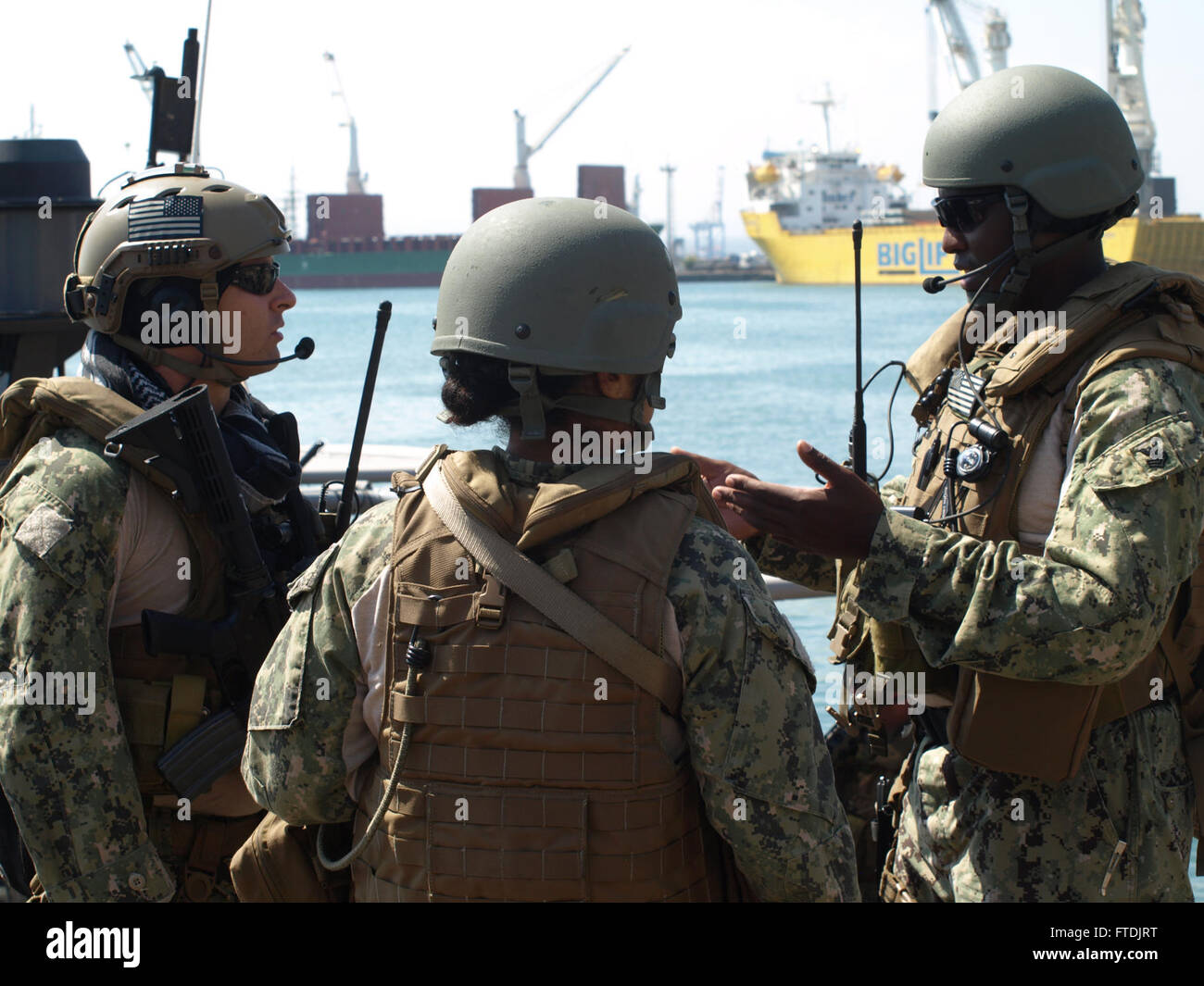 Personnel from Coastal Riverine Squadron 10 conduct a crew swap brief ...
