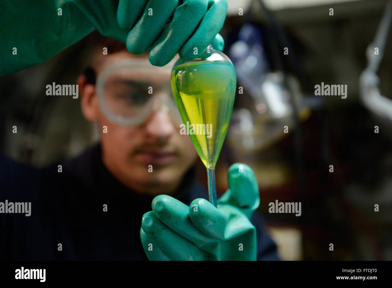 Gas Turbine Systems Technician Fireman Brandon Seymer performs a bottom ...