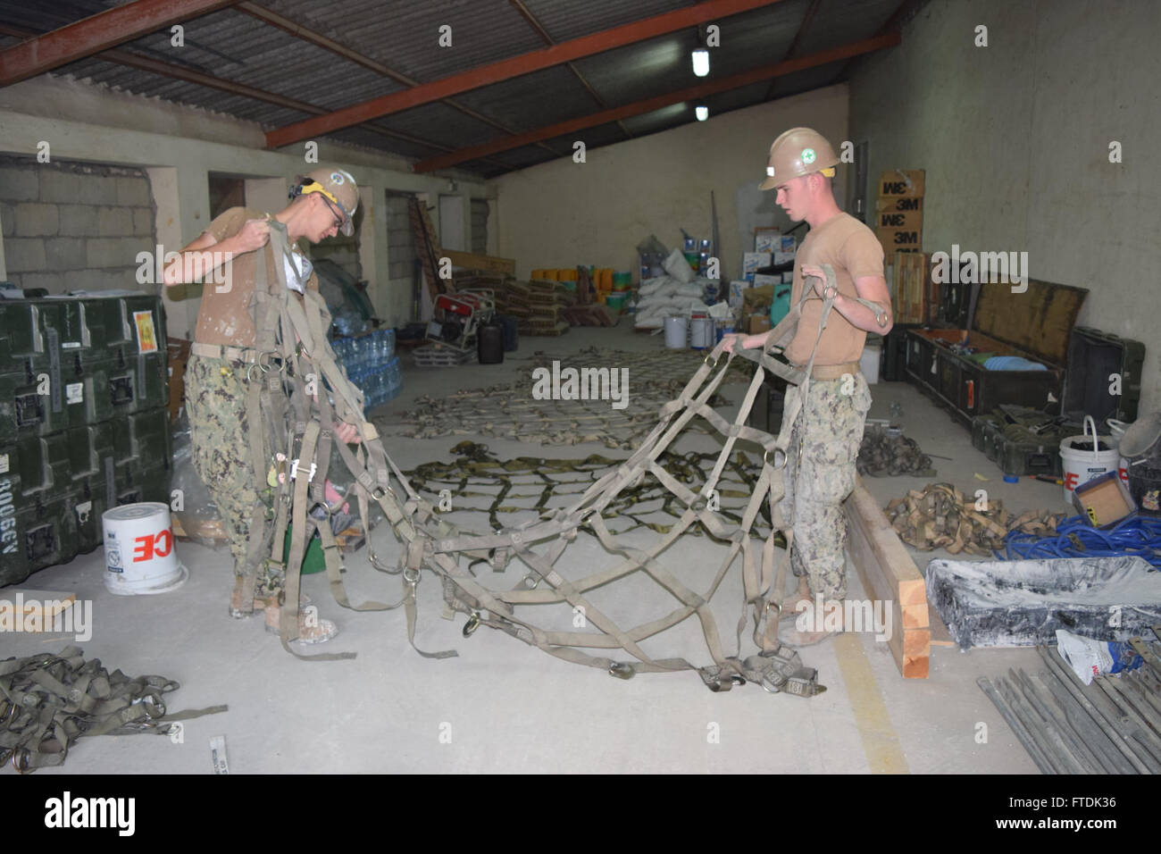 This image captures two U.S. Navy Construction Electricians from Naval ...