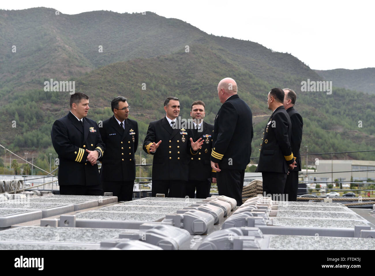 Sailors aboard the USS Ross (DDG 71), an Arleigh Burke-class guided ...