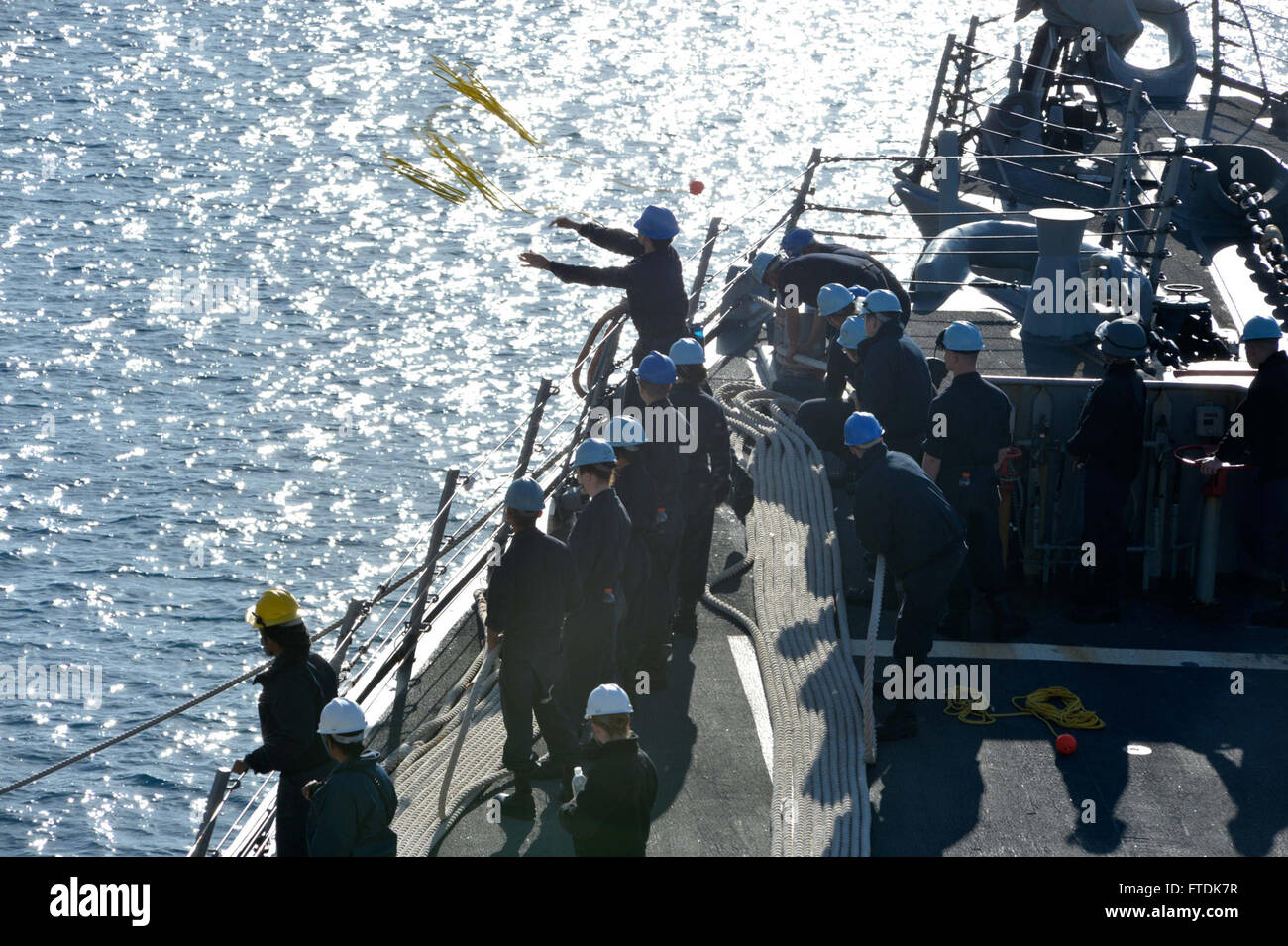Sailors aboard the USS Ross (DDG 71), an Arleigh Burke-class guided ...