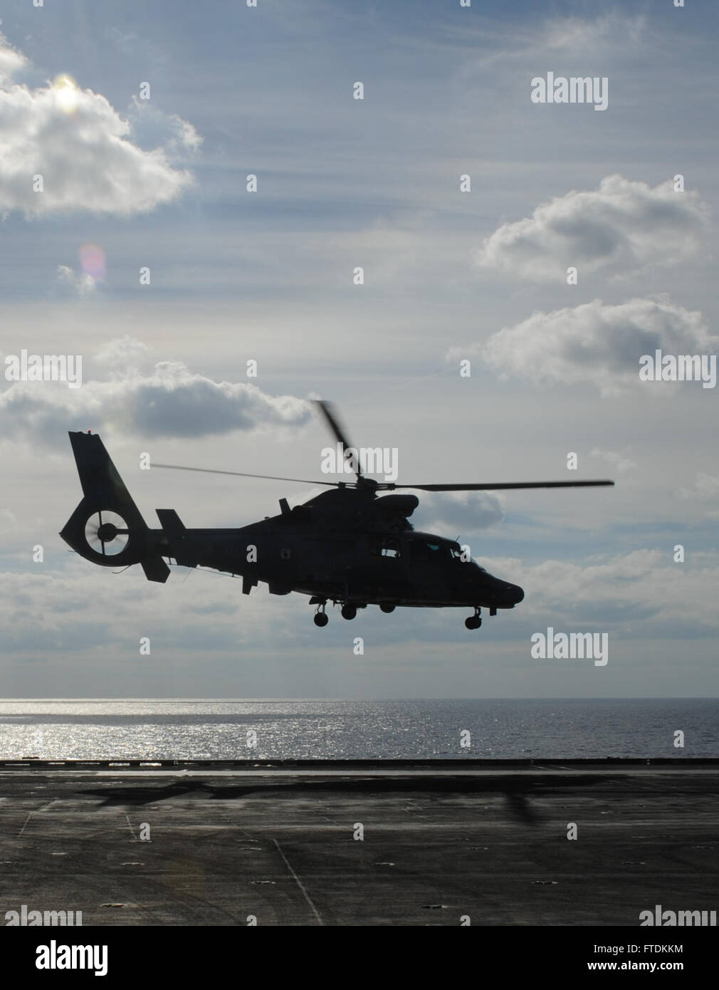 A French Navy AS565 Panther Helicopter lifts off from the USS Nimitz ...