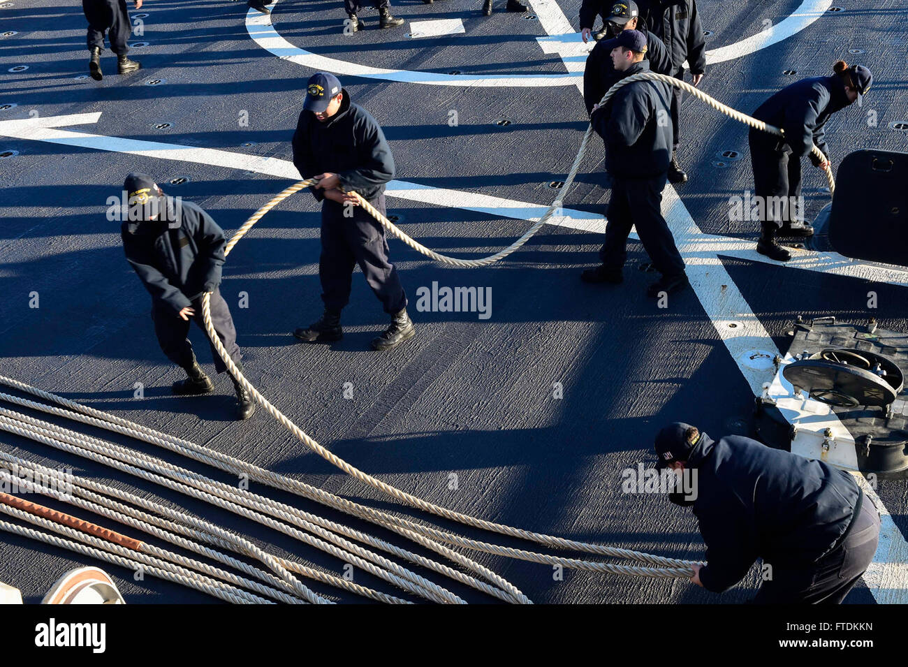 This U.S. Navy photo shows sailors aboard the USS Carney (DDG 64 ...