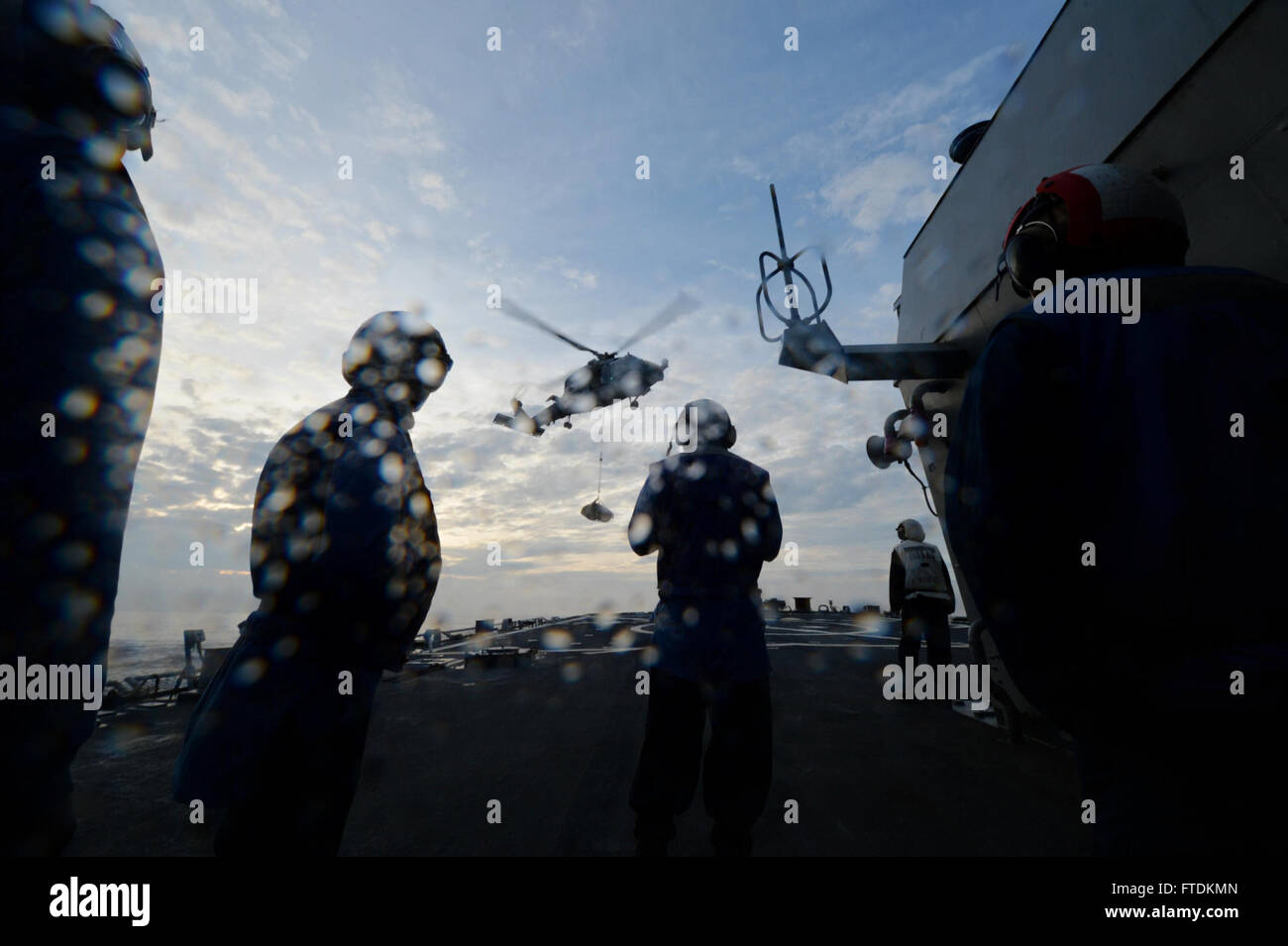 This image shows a Spanish SH-60F Sea Hawk helicopter conducting ...