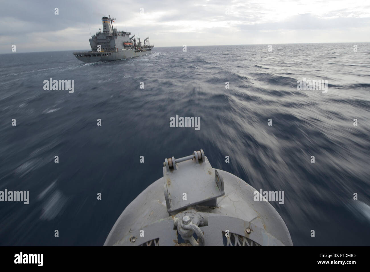 The USS Carney (DDG 64), an Arleigh Burke-class destroyer, approaches ...