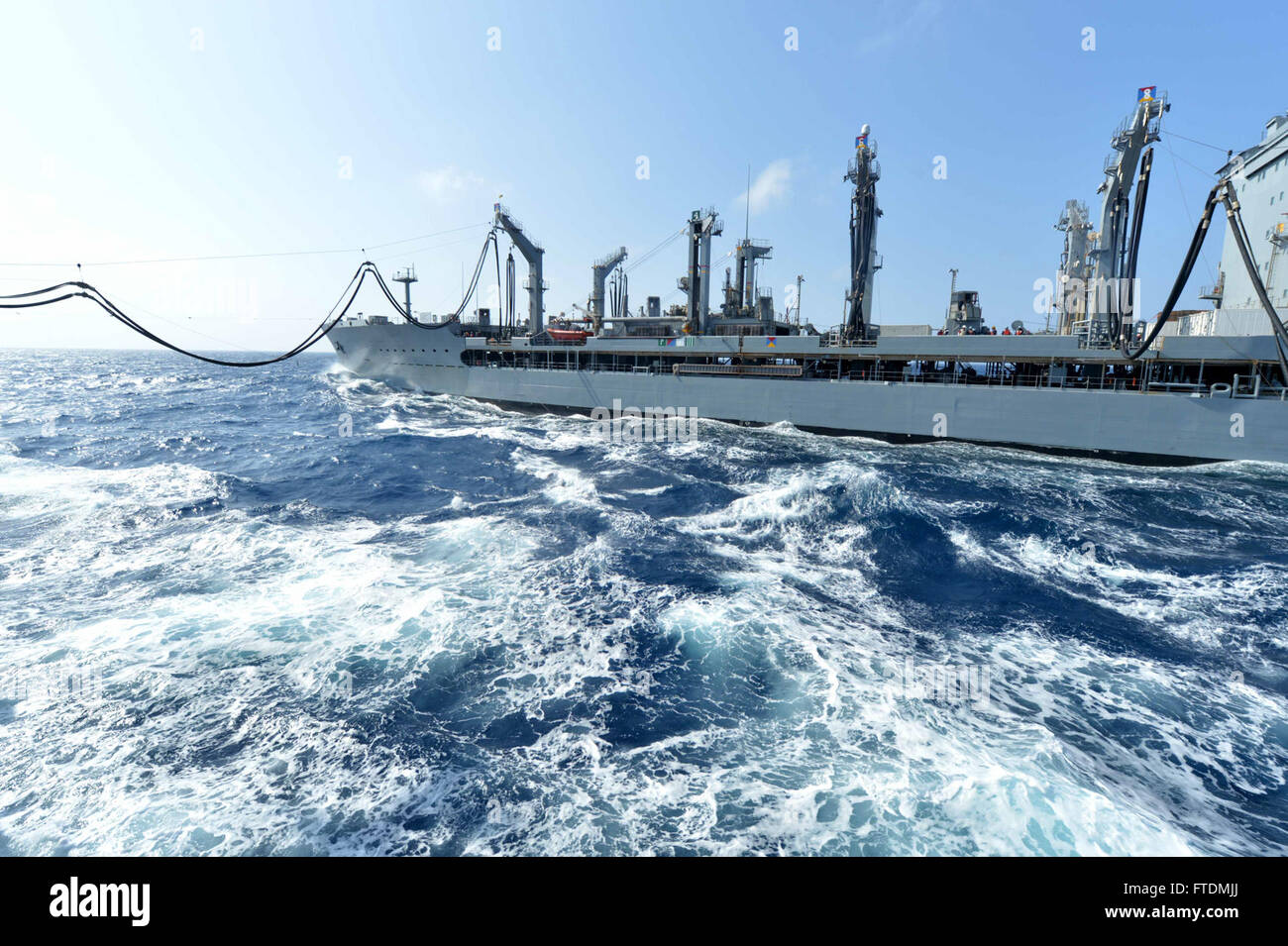 Sailors aboard the USS Ross (DDG 71) perform a replenishment-at-sea ...
