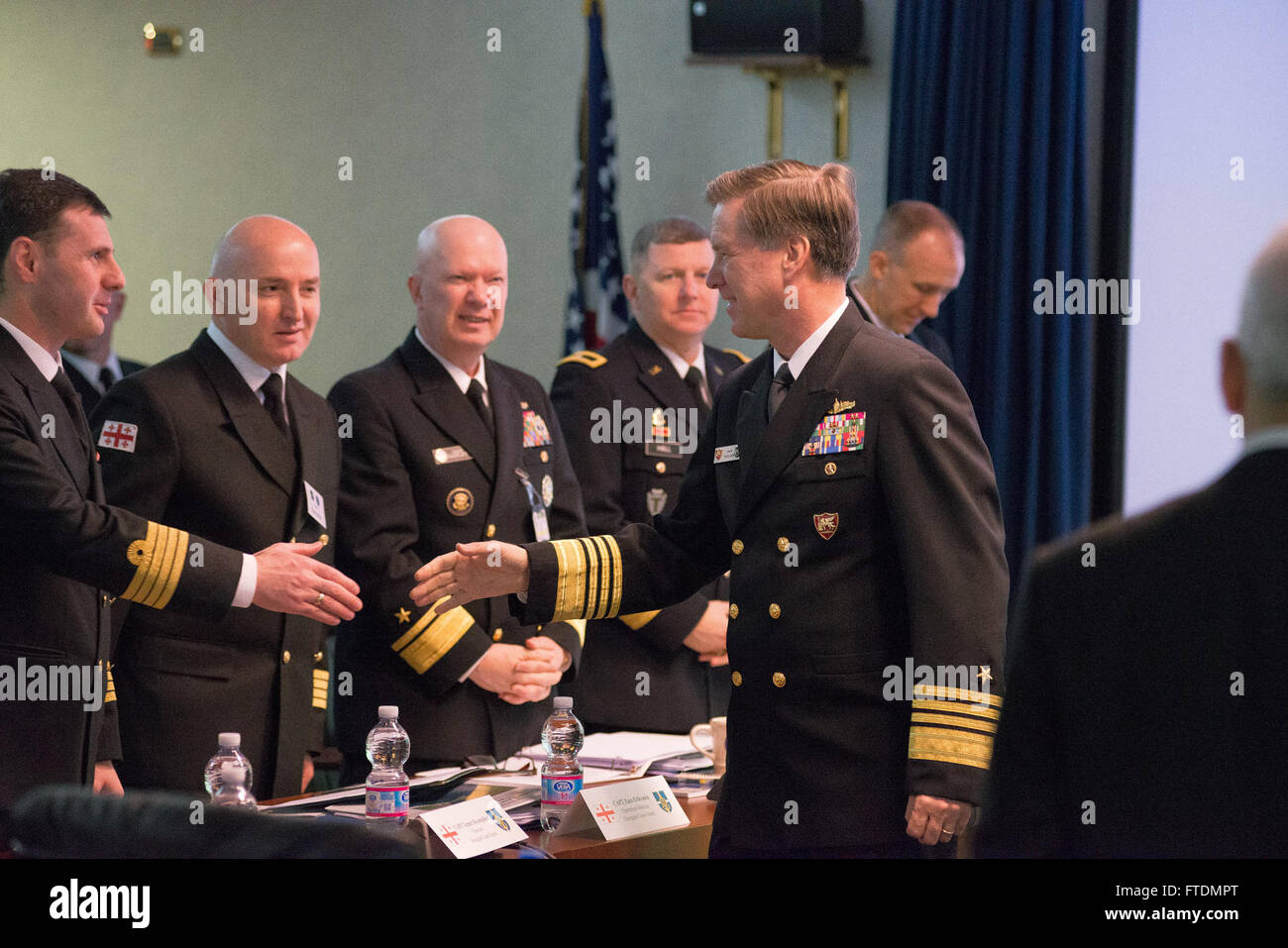This image captures Admiral Mark Ferguson welcoming senior maritime ...