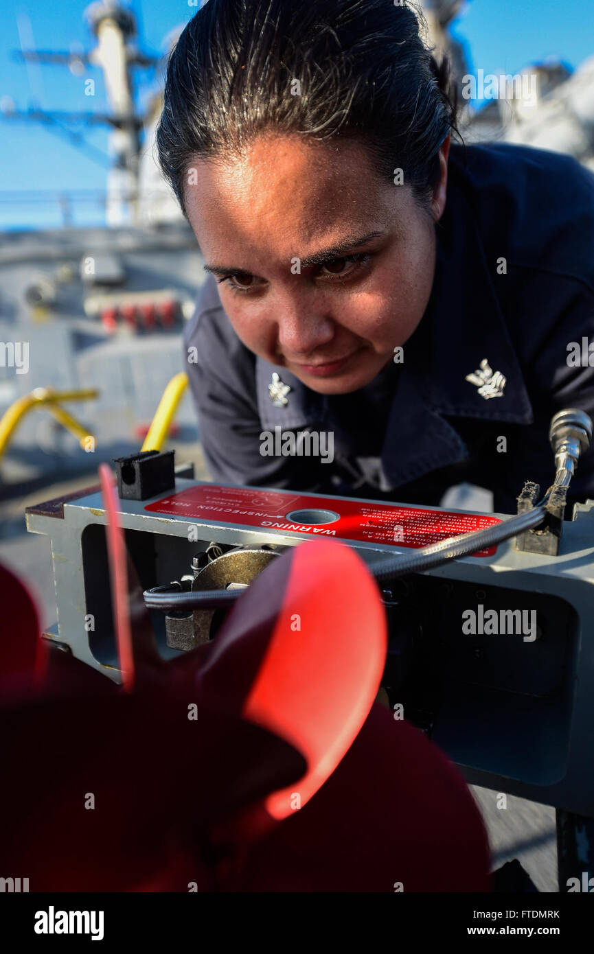 Fire Controlman 1st Class Marisol Erving secures a Mark 46 torpedo ...