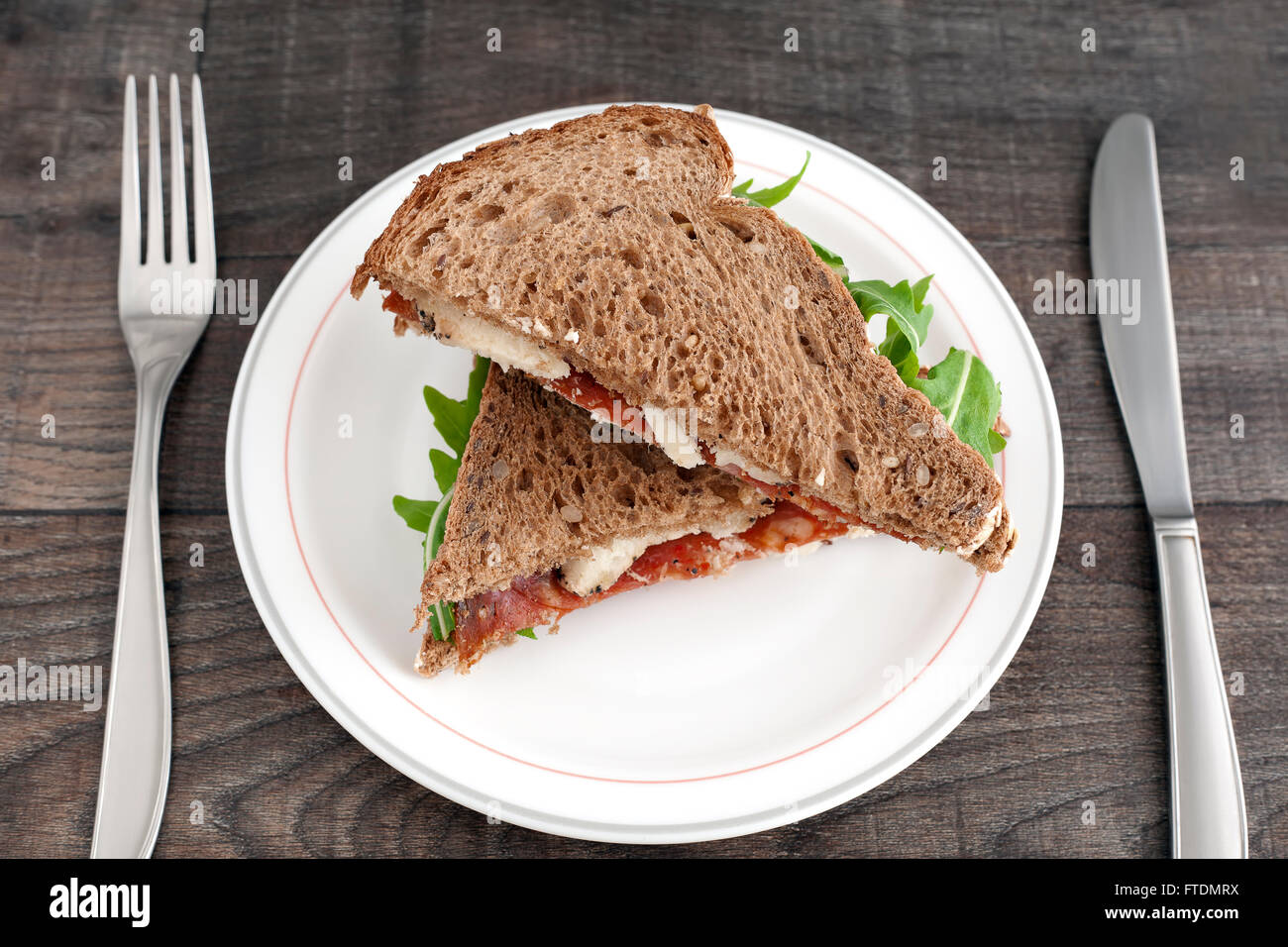 Italian salami and sheep cheese sandwich with brown bread Stock Photo ...