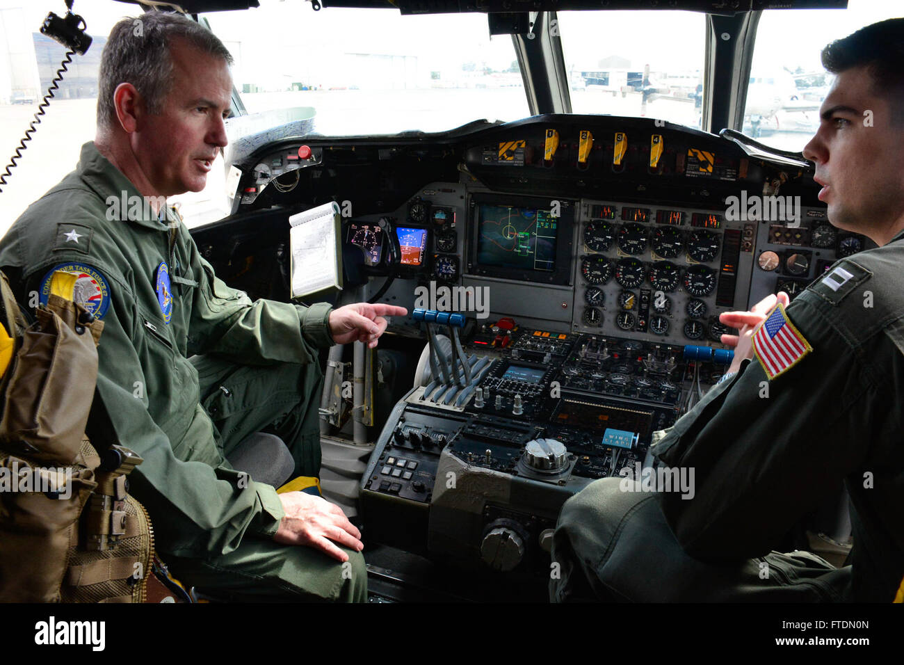 Rear Adm. Matt Zirkle, commander of Submarines NATO, reviews flight ...