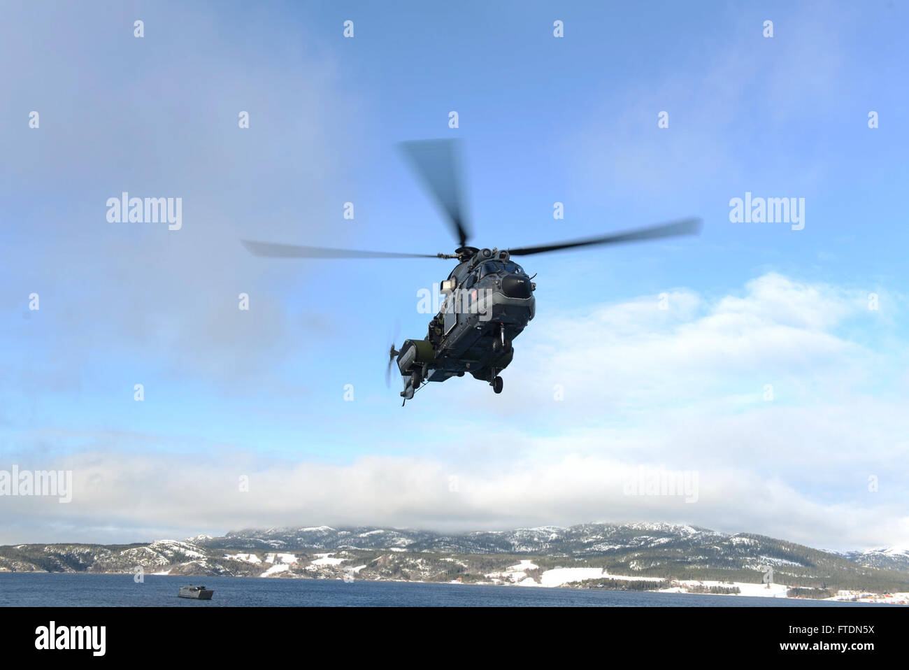 A Dutch NH90 helicopter prepares to land on the USS Fort McHenry (LSD 43) during Exercise Cold ...