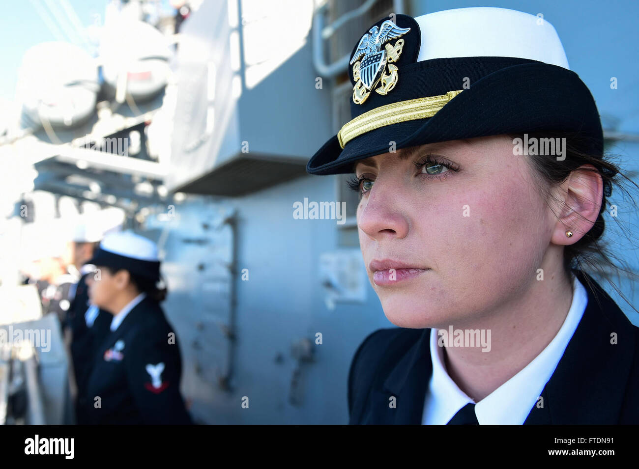 Sailors aboard the USS Carney (DDG 64), an Arleigh Burke-class guided ...