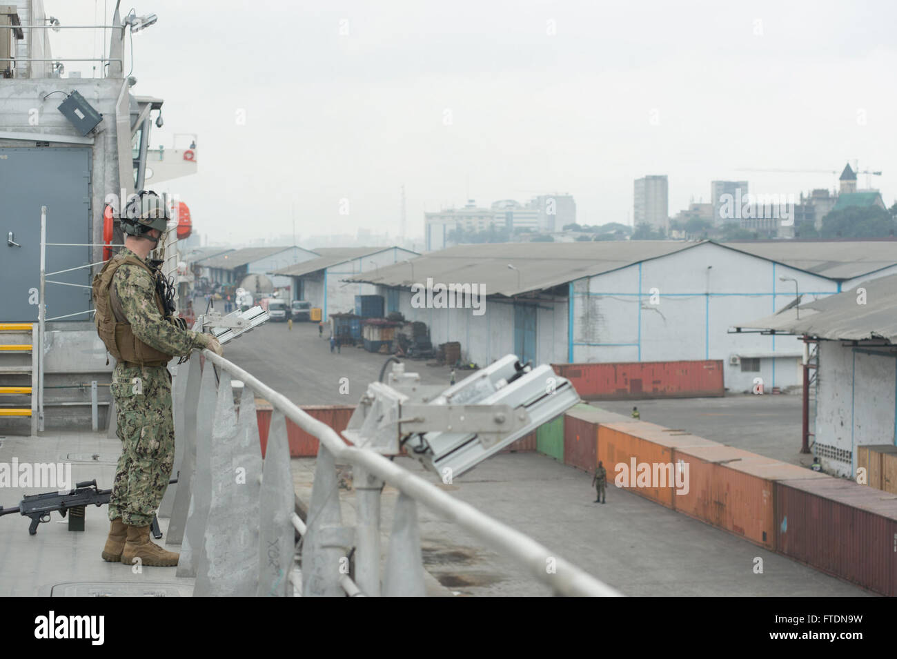 Boatswain's Mate 3rd Class Brian Collins stands watch aboard the USNS ...