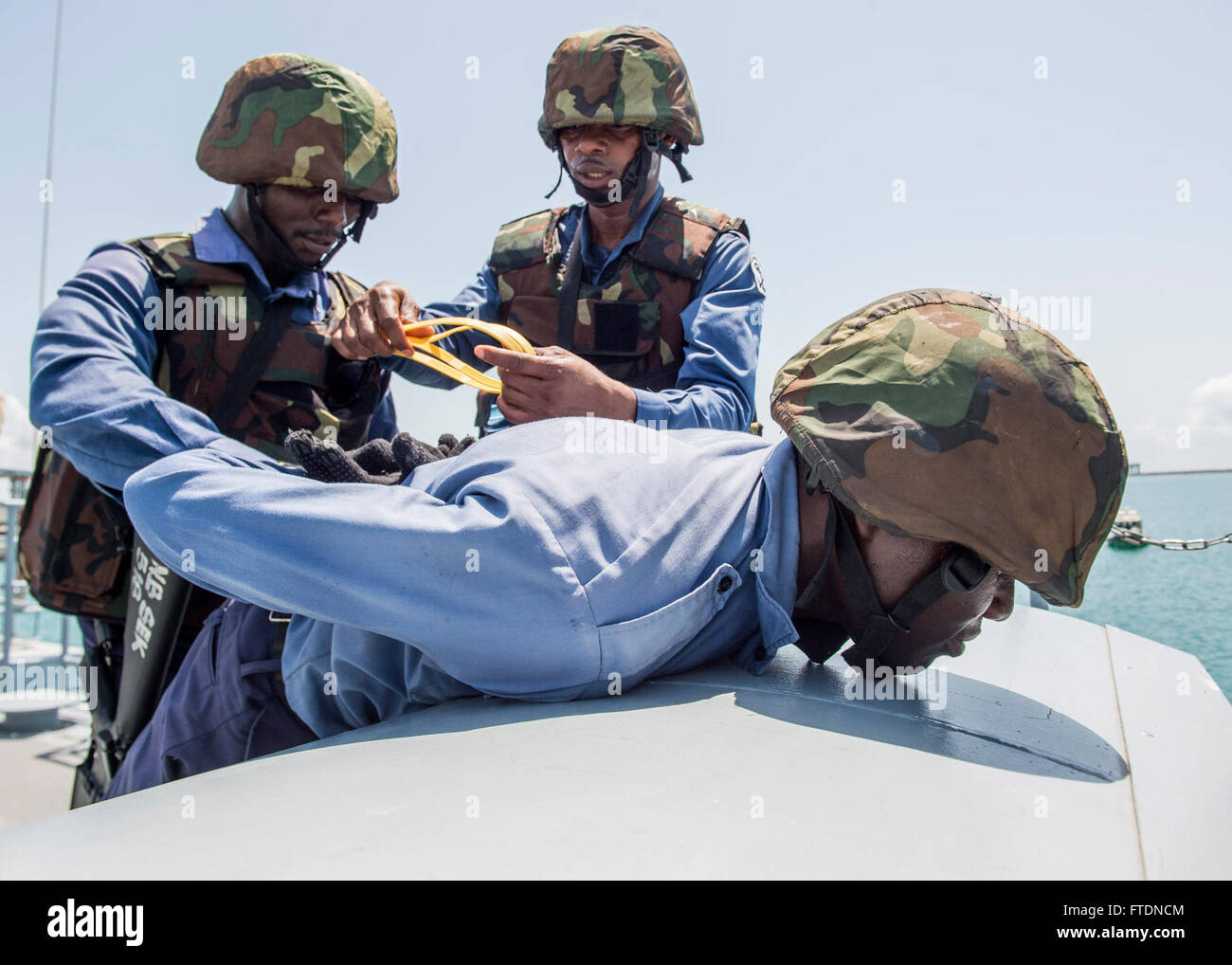 Ghanaian Navy sailors aboard the GNS Naa Gbewaa conduct a simulated ...