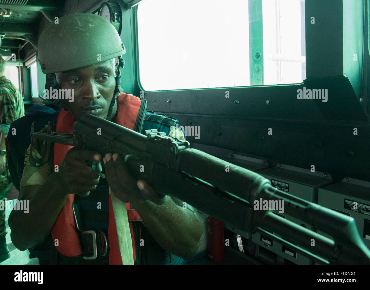 A Gabon navy sailor participates in a boarding exercise aboard the USNS ...