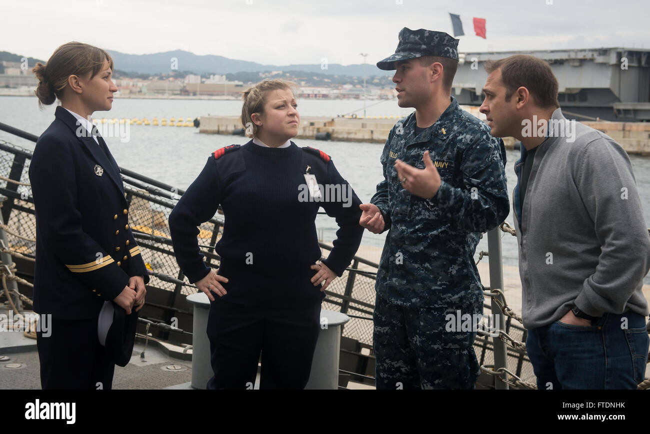 Ensign Enrique Portillo from the USS Porter (DDG 78) conducts a tour ...