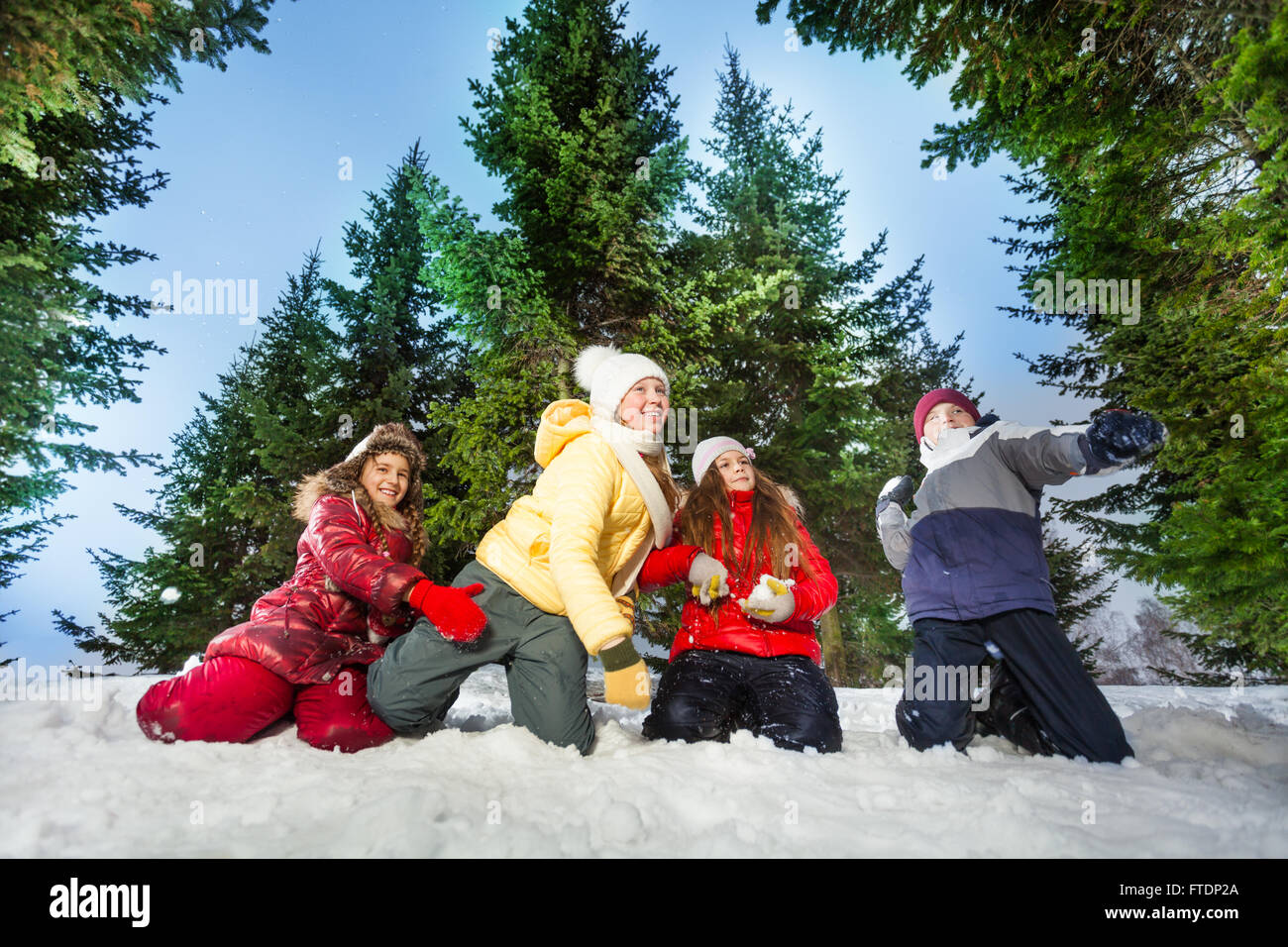 Kids playing snowballs hi-res stock photography and images - Alamy
