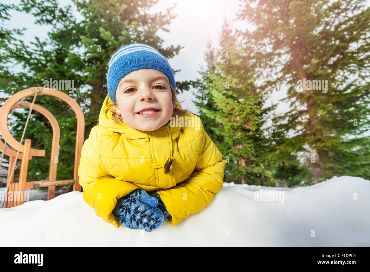 Close portrait of little boy in snow park Stock Photo - Alamy